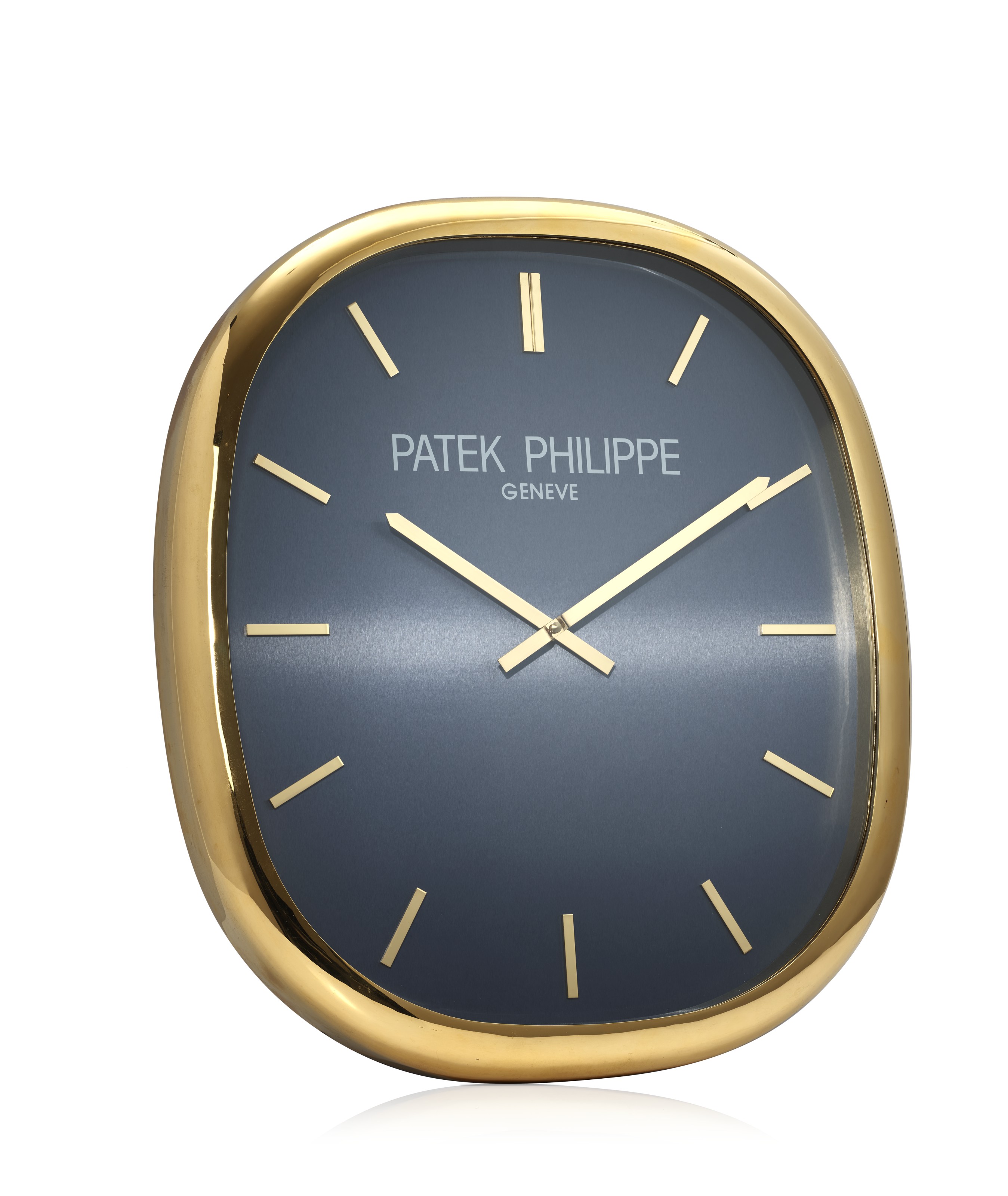 INDUCTA FOR PATEK PHILIPPE, LARGE GILT METAL WALL CLOCK, ELLIPSE MODEL ...