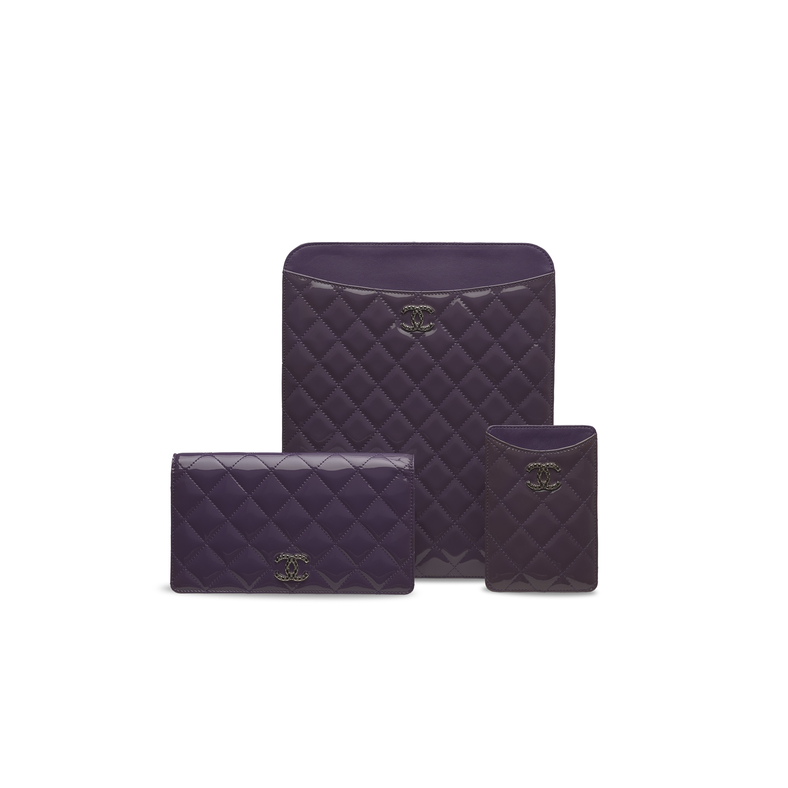 A SET OF THREE: A VIOLET QUILTED PATENT LEATHER WALLET WITH SILVER ...