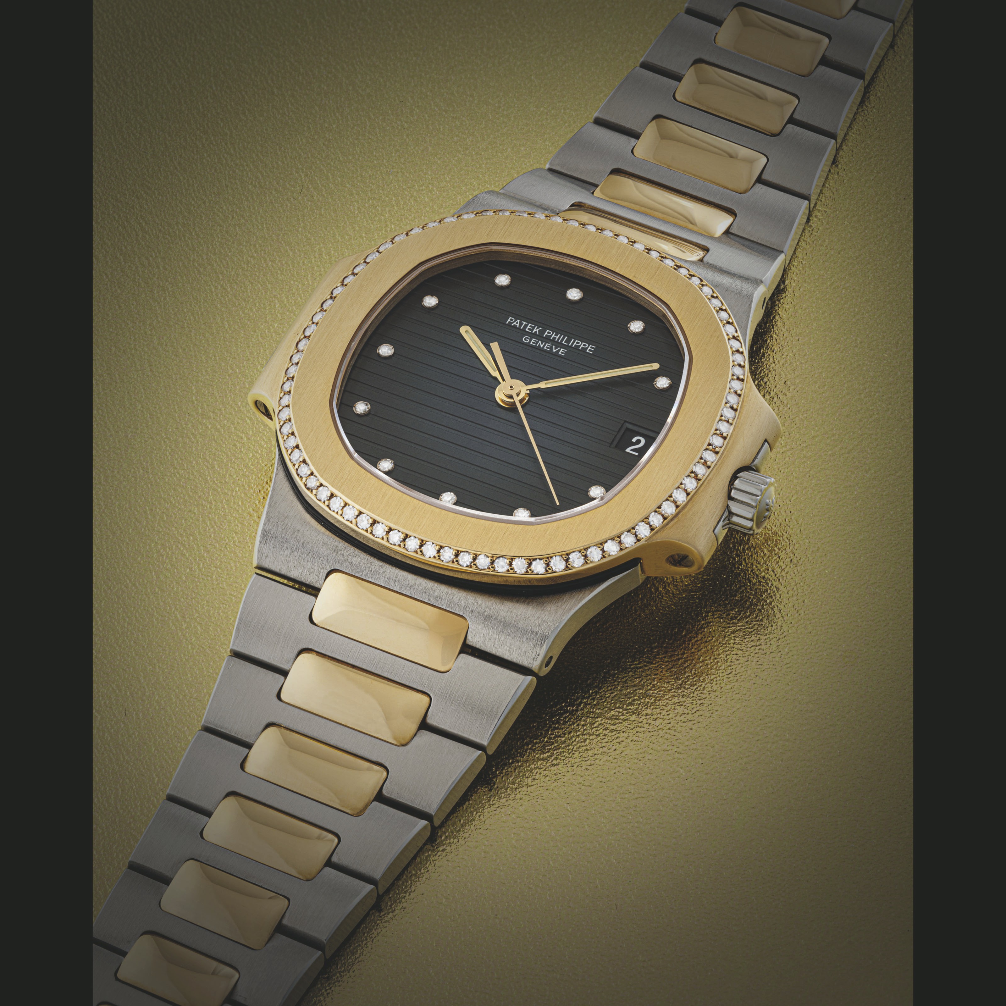 PATEK PHILIPPE. AN 18K GOLD, DIAMOND AND EMERALD-SET AUTOMATIC ...