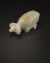A FINELY-CARVED WHITE AND RUSSET JADE 'GOLDFISH' BOX AND COVER, QING ...