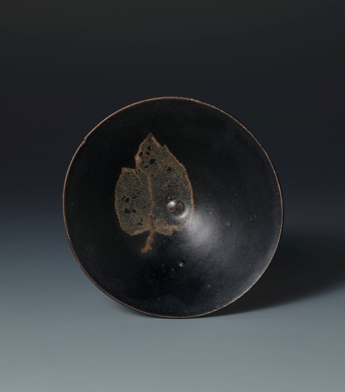 A JIZHOU LEAF-DECORATED CONICAL TEA BOWL, SOUTHERN SONG DYNASTY (1127 ...