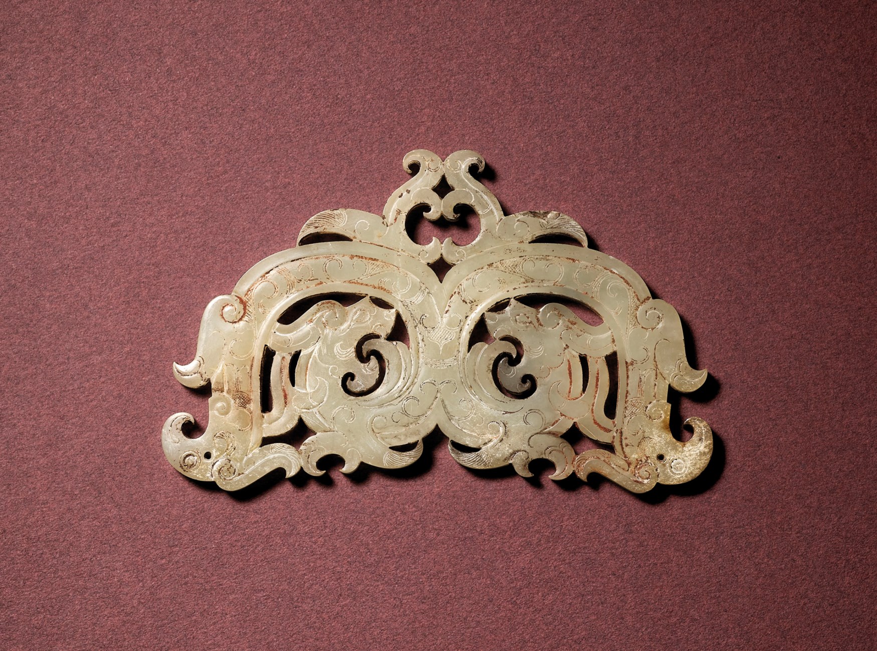 A VERY RARE AND FINELY CARVED GREYISH-WHITE JADE RETICULATED ‘DRAGON ...