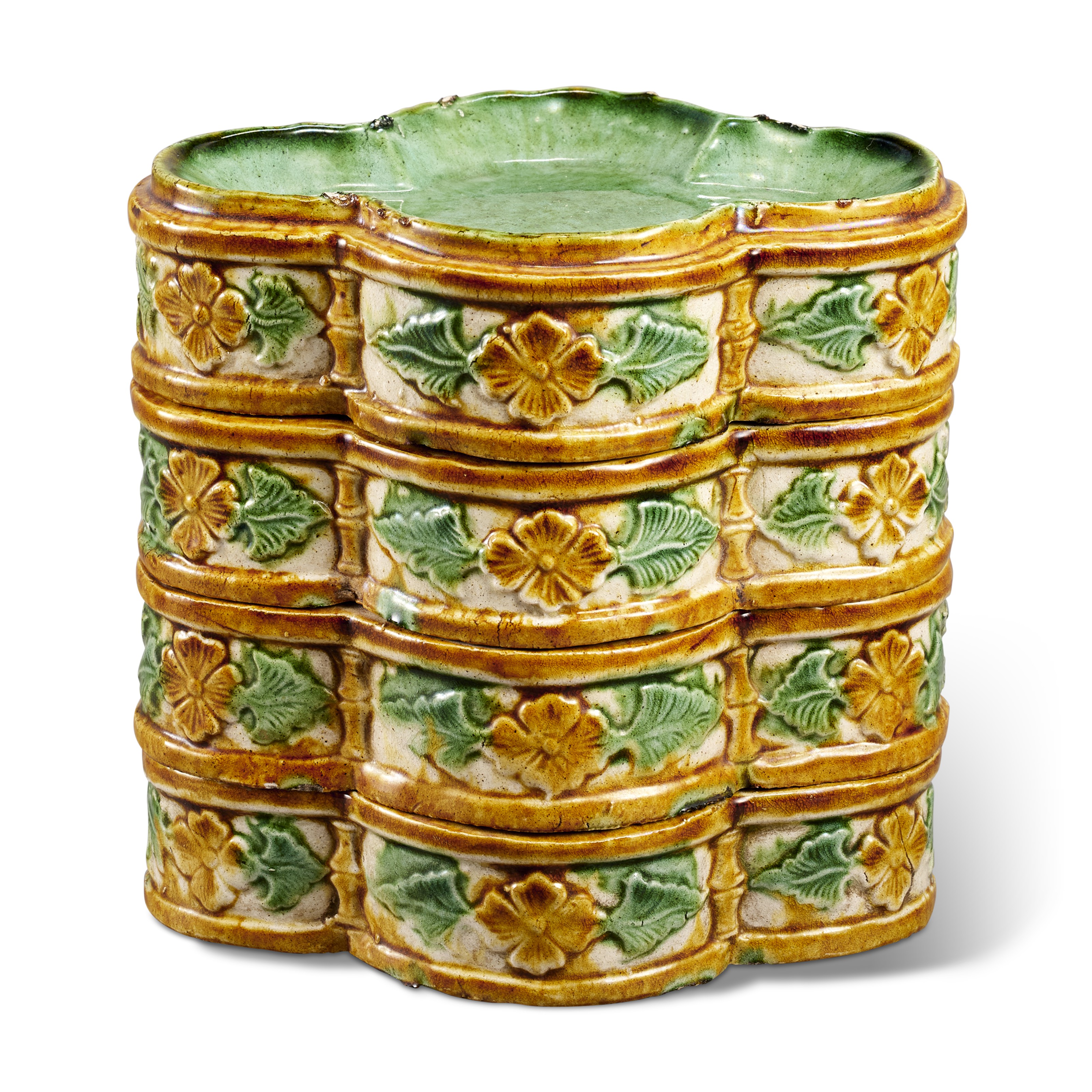A SET OF FOUR SMALL SANCAI-GLAZED STACKING QUATRELOBED DISHES, LIAO ...
