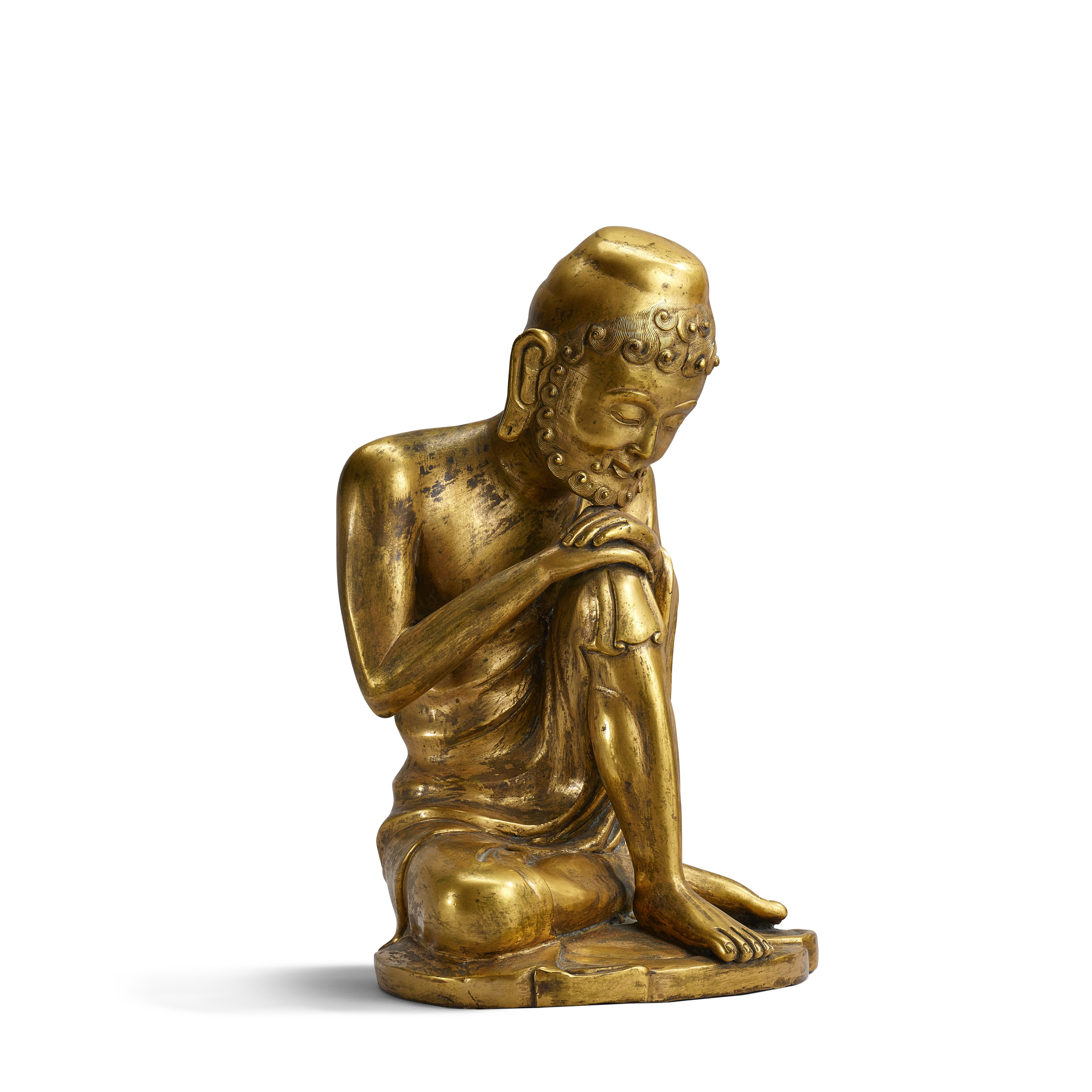 A GILT-BRONZE FIGURE OF A SEATED LUOHAN, | Christie’s
