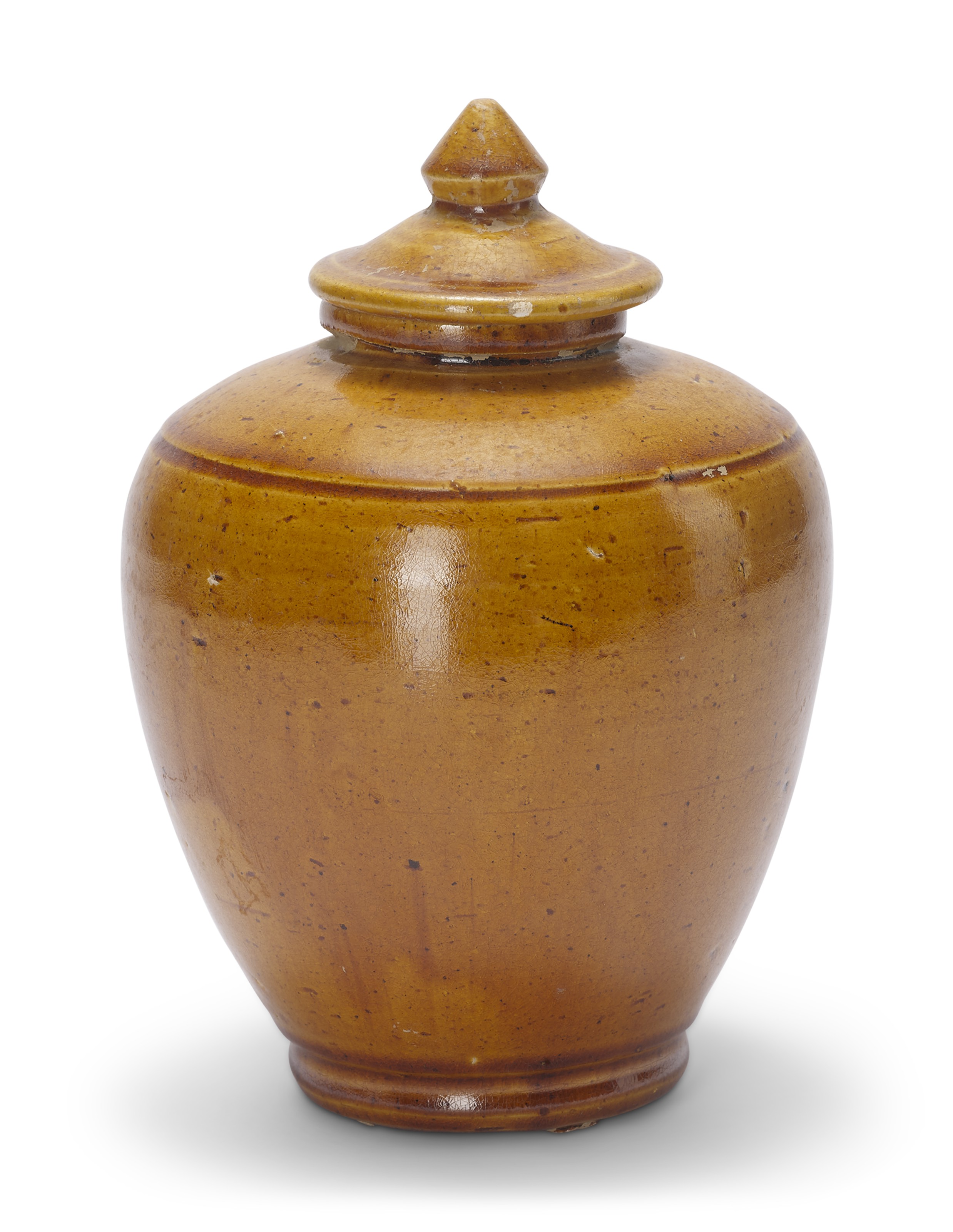 AN AMBER-GLAZED POTTERY JAR AND COVER, TANG DYNASTY (618-907) | Christie’s