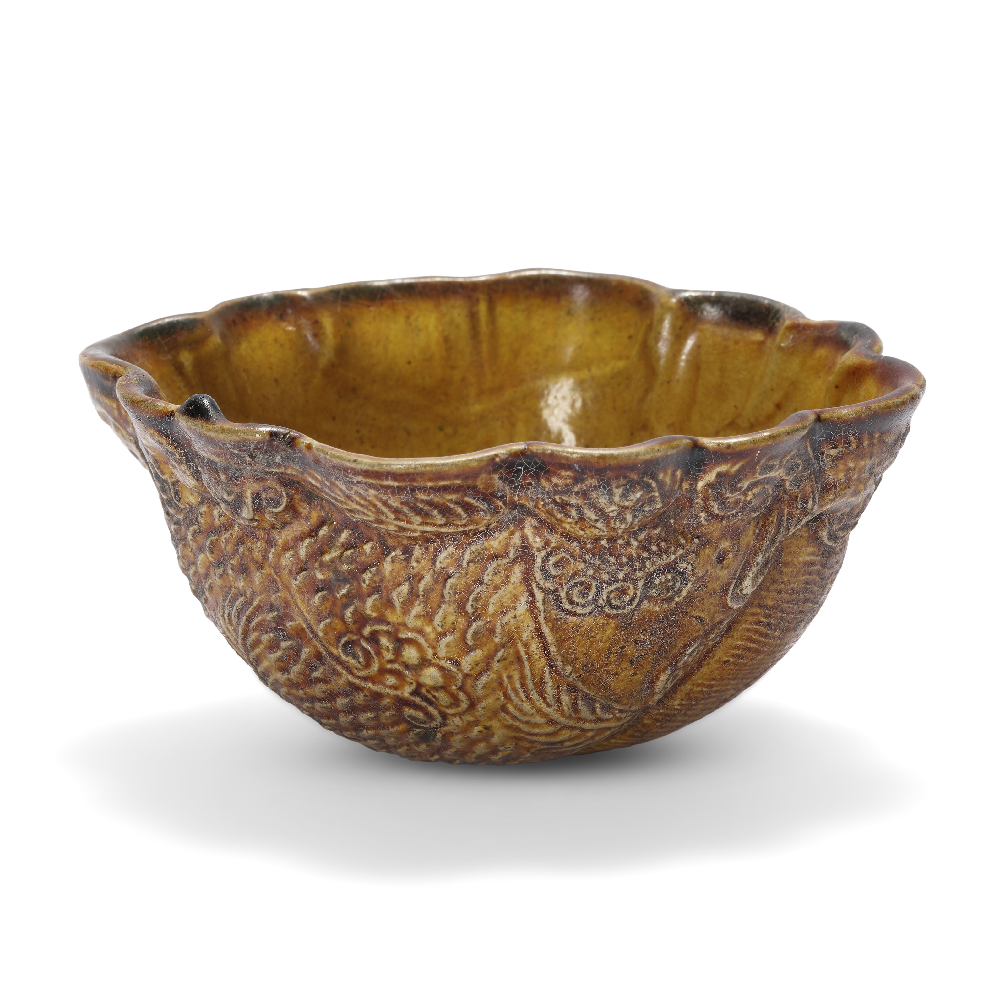 A MOULDED AMBER-GLAZED ‘FISH’ CUP, TANG DYNASTY (618-907) | Christie’s