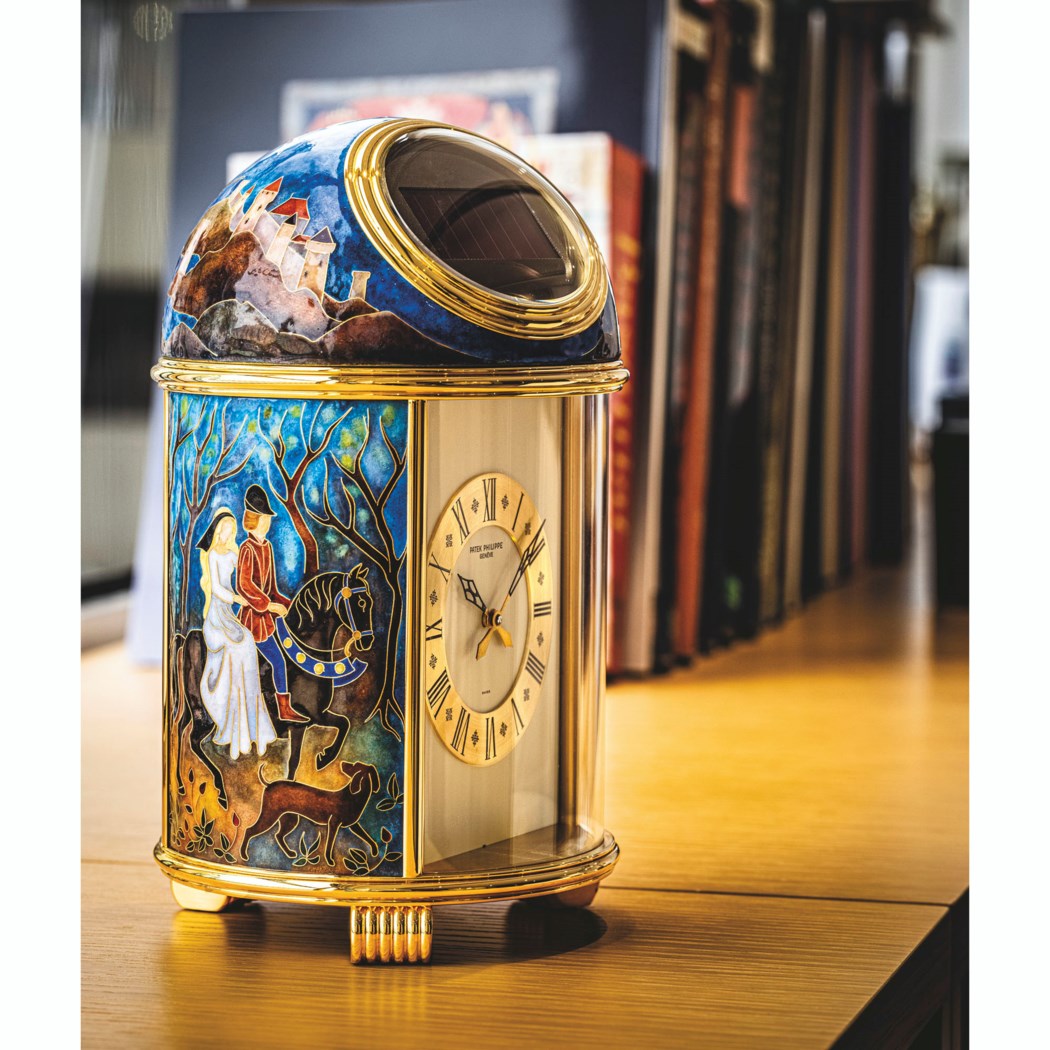 PATEK PHILIPPE. A UNIQUE GILT BRASS SOLAR POWERED DOME CLOCK WITH ...