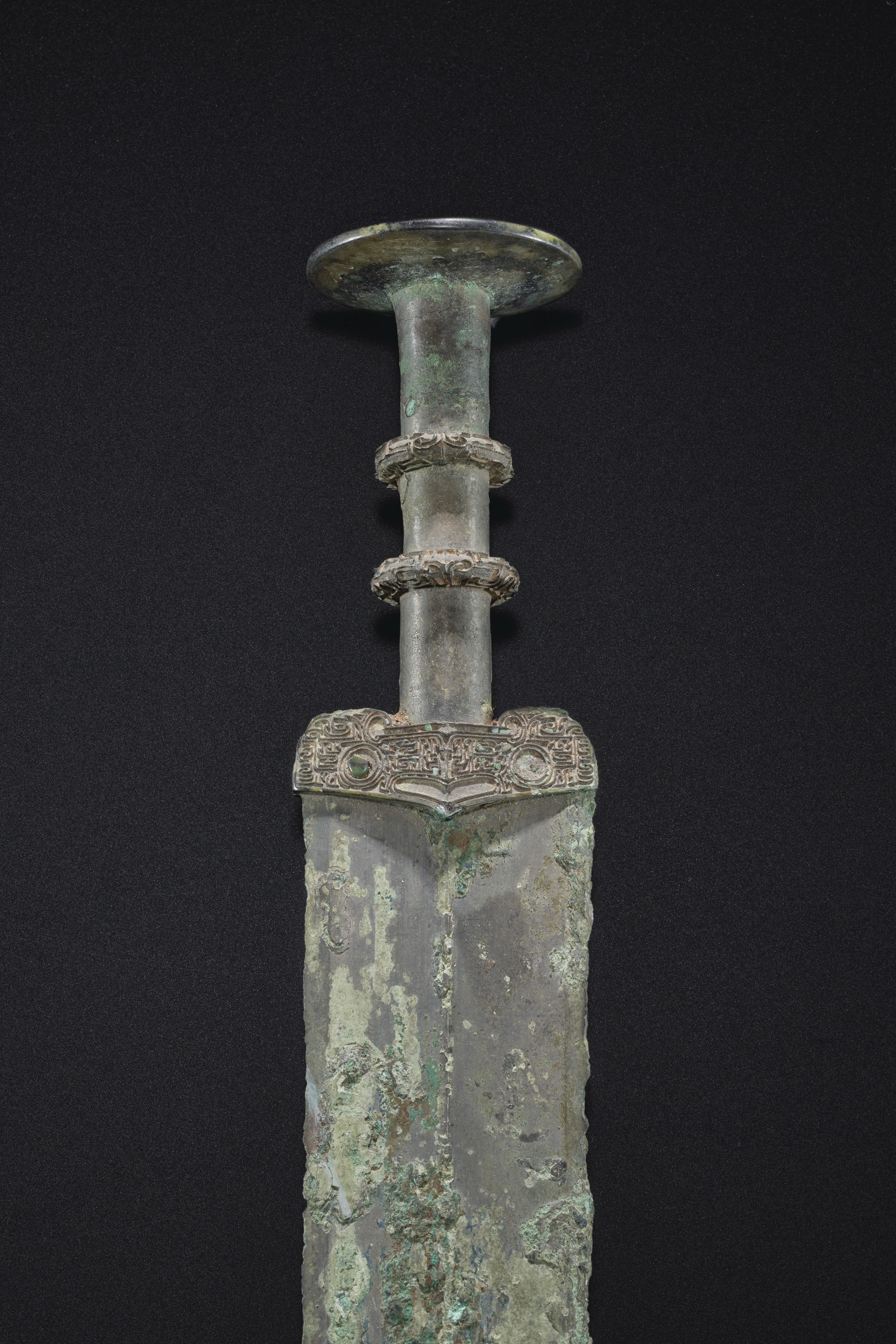 A FINELY CAST BRONZE SWORD