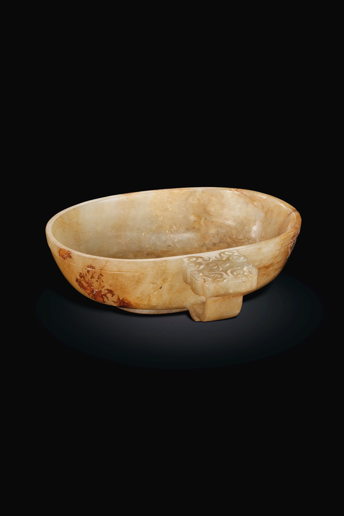 A BEIGE AND PALE RUSSET JADE OVAL CUP WITH HANDLE, MING DYNASTY (1368 ...