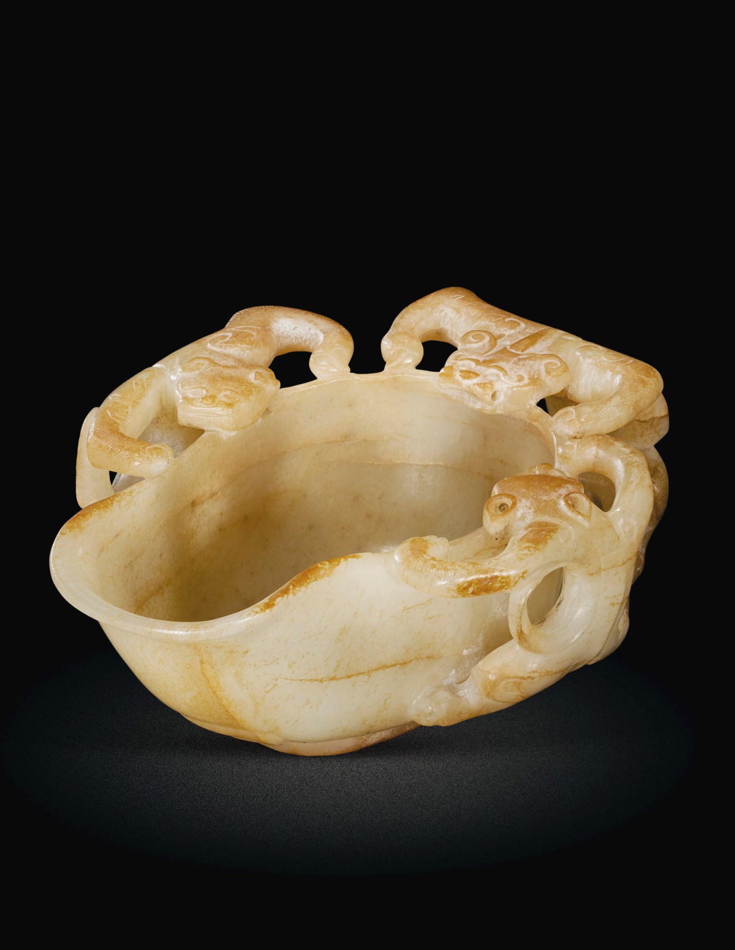 A WHITE AND PALE RUSSET JADE POURING VESSEL, MING-EARLY QING DYNASTY ...