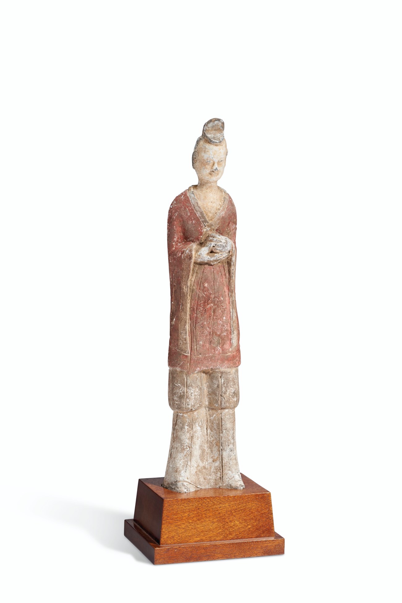 A PAINTED POTTERY FIGURE OF A MILITARY OFFICIAL, NORTHERN WEI DYNASTY ...