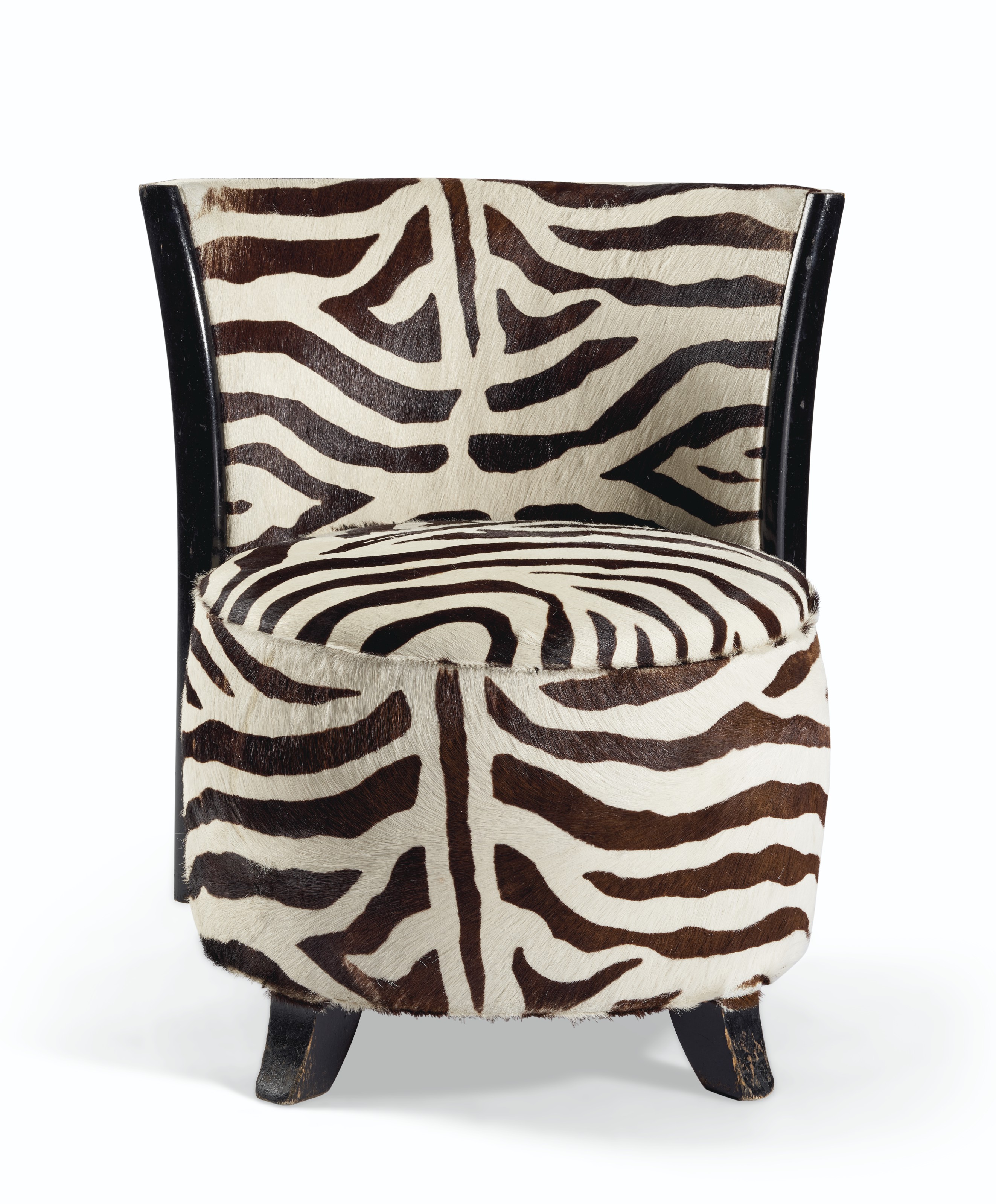 A ZEBRA-SKIN AND EBONIZED LOW CHAIR, 20TH CENTURY | Christie’s