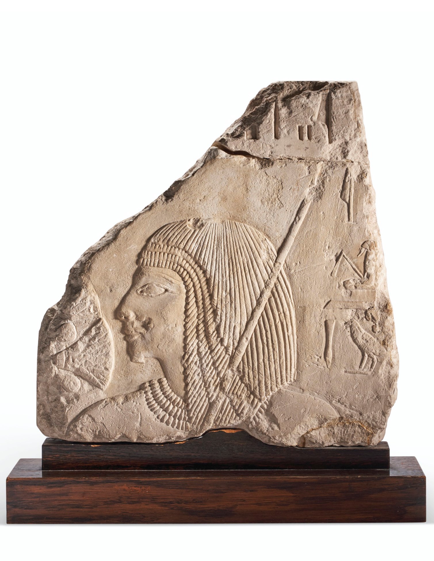 AN EGYPTIAN LIMESTONE RELIEF FRAGMENT, NEW KINGDOM, EARLY 19TH DYNASTY ...