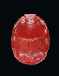 A GREEK CARNELIAN SCARAB WITH A RUNNING YOUTH