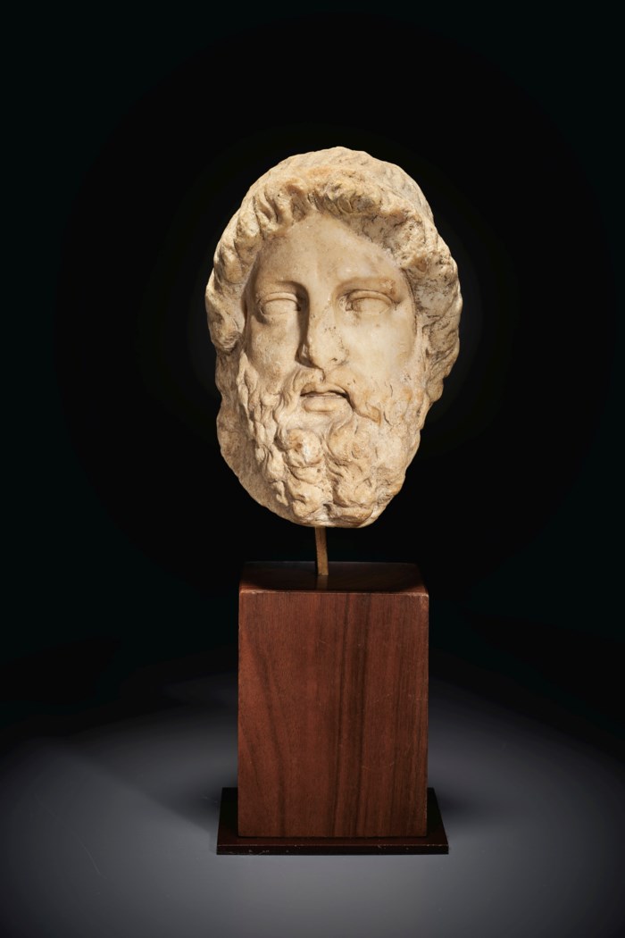 A GREEK MARBLE MALE HEAD, LATE CLASSICAL TO EARLY HELLENISTIC PERIOD ...