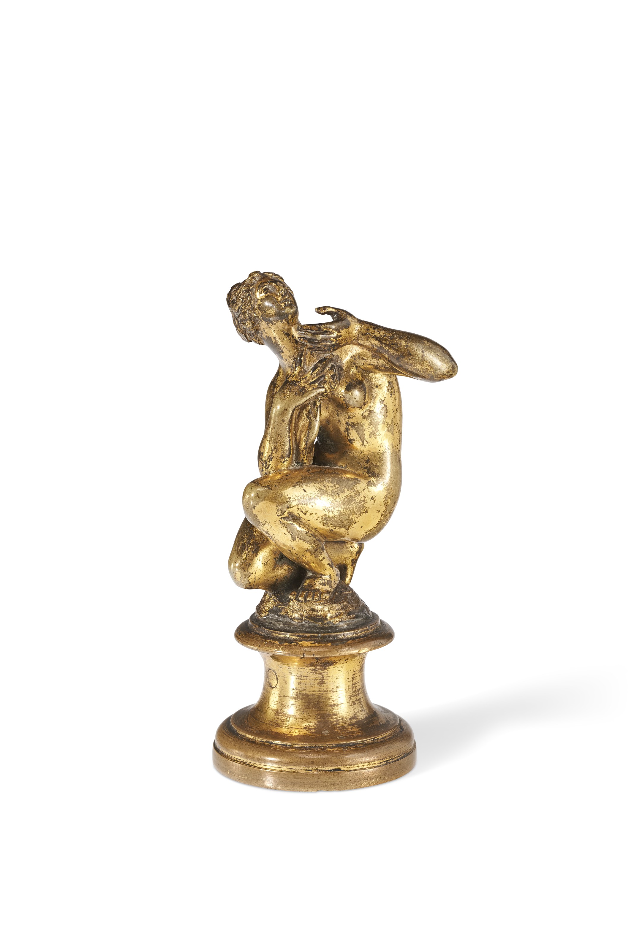 A GILT-BRONZE FIGURE OF A WOMAN BATHING, AFTER THE MODEL BY GIAMBOLOGNA ...