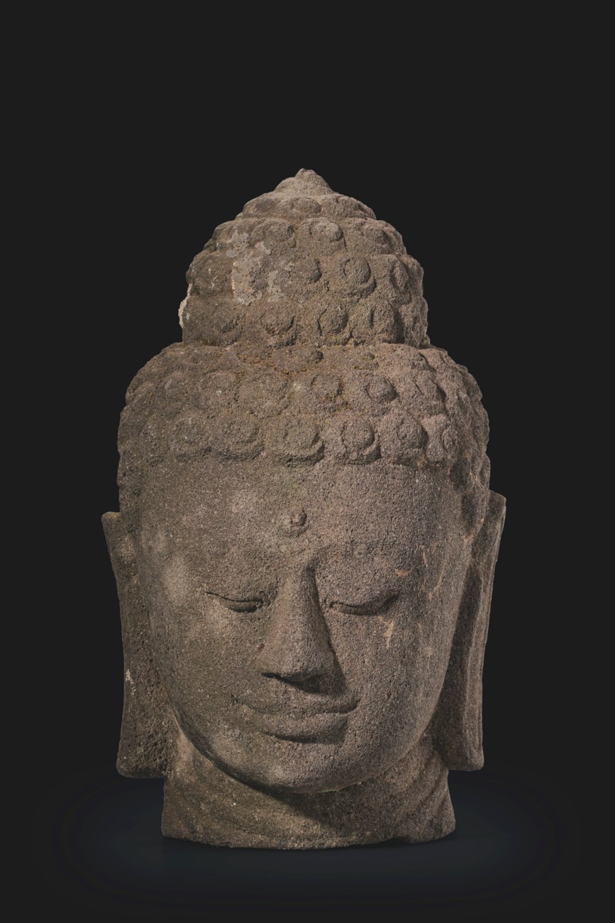 AN ANDESITE HEAD OF BUDDHA, INDONESIA, JAVA, 9TH-10TH CENTURY | Christie's