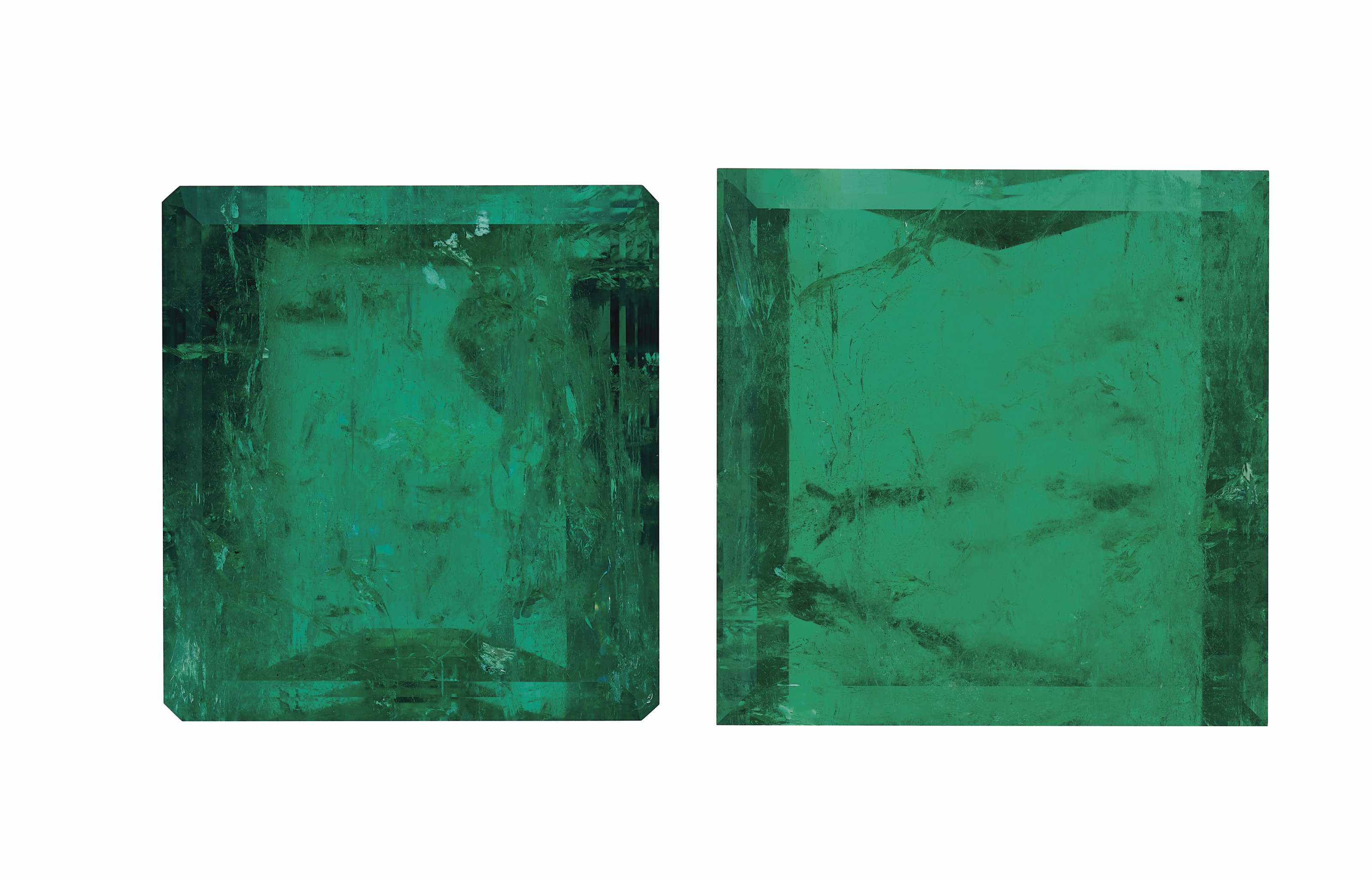 TWO UNMOUNTED EMERALDS