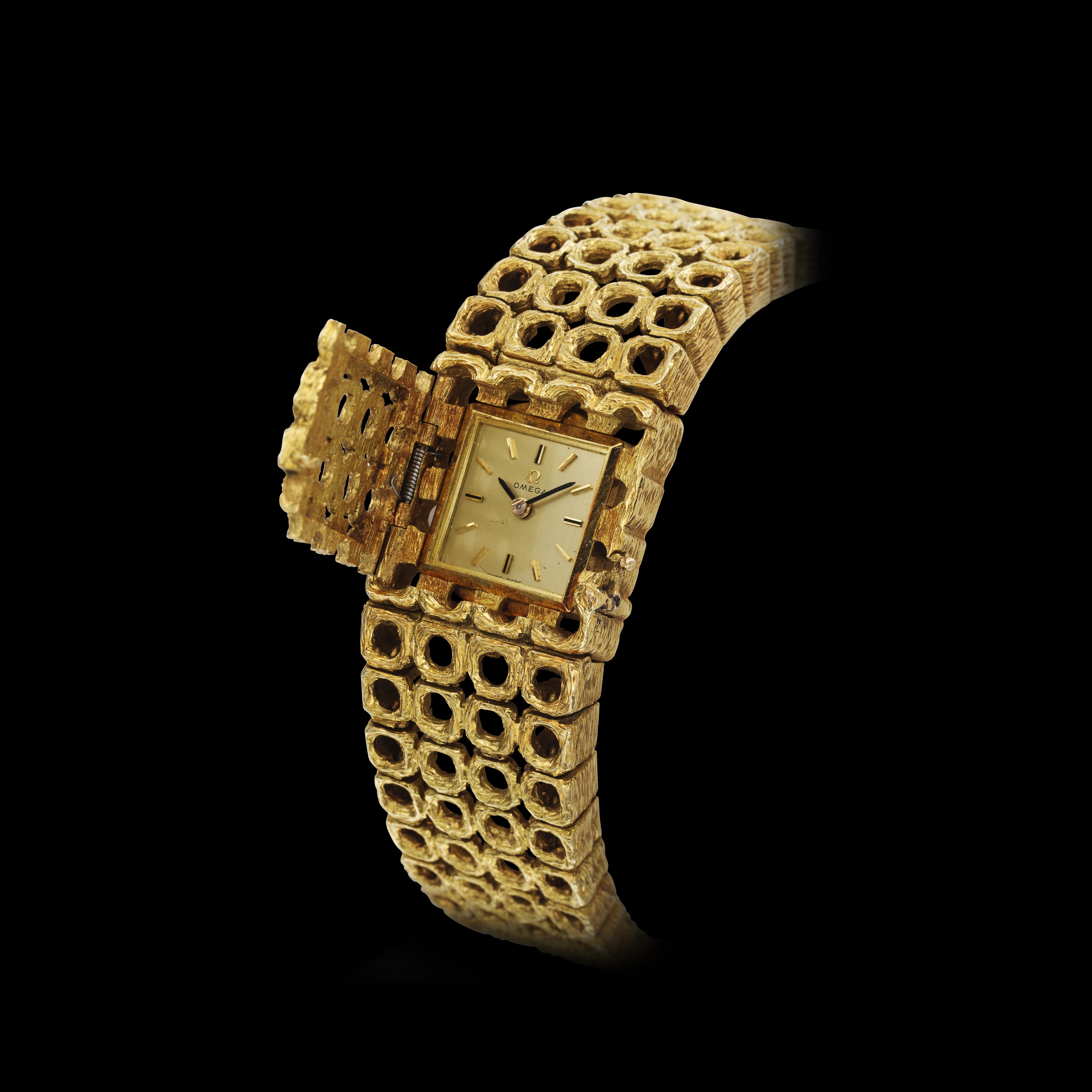 OMEGA, DESIGNED BY GILBERT ALBERT, 18K YELLOW GOLD CONCEALED LADIES ...