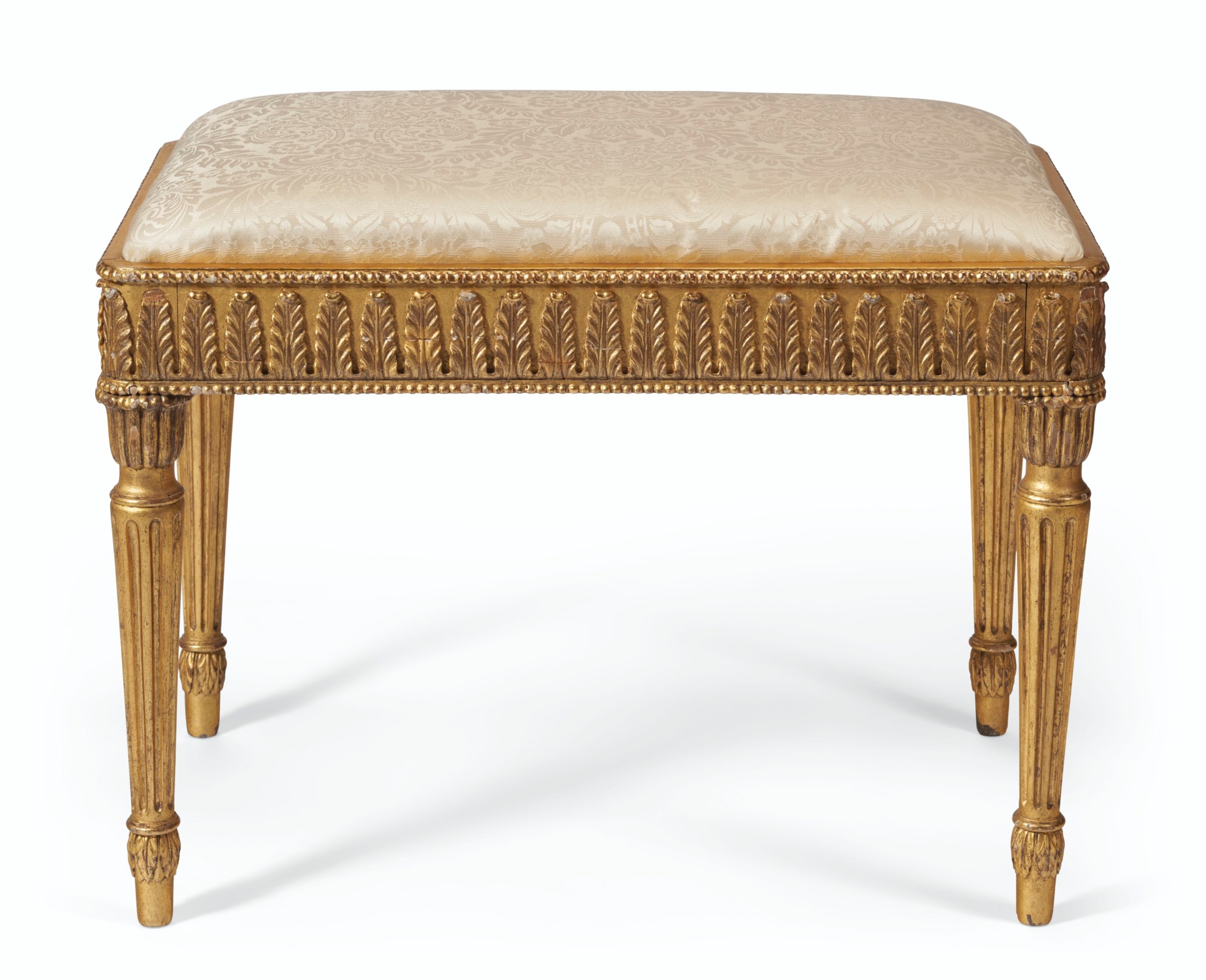 A LATE GEORGE III GILTWOOD AND GILT-COMPOSITION STOOL, CIRCA 1790-1800 ...