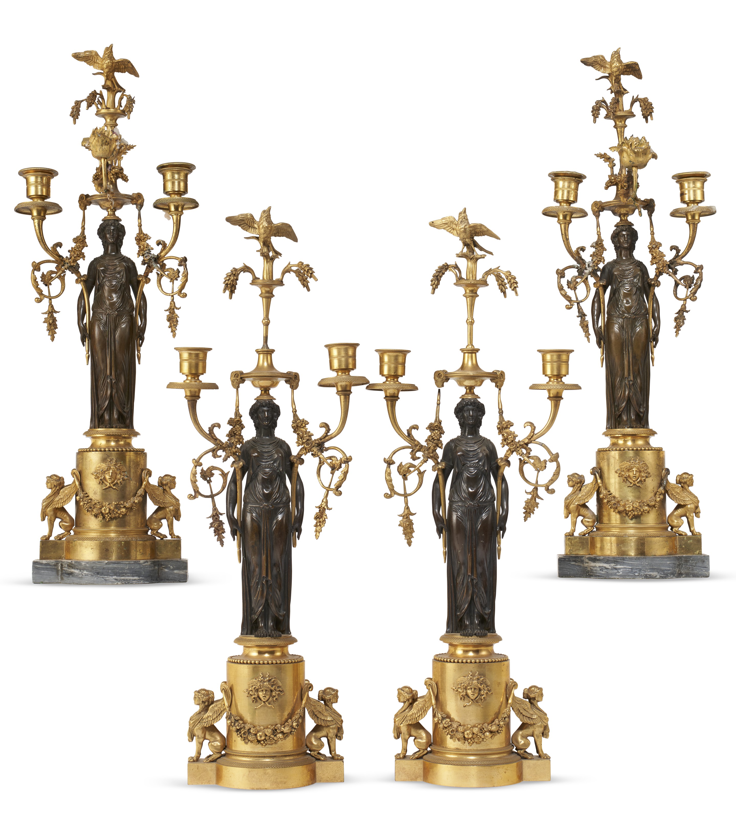 A SET OF FOUR RUSSIAN ORMOLU AND PATINATED BRONZE FIGURAL CANDELABRA ...