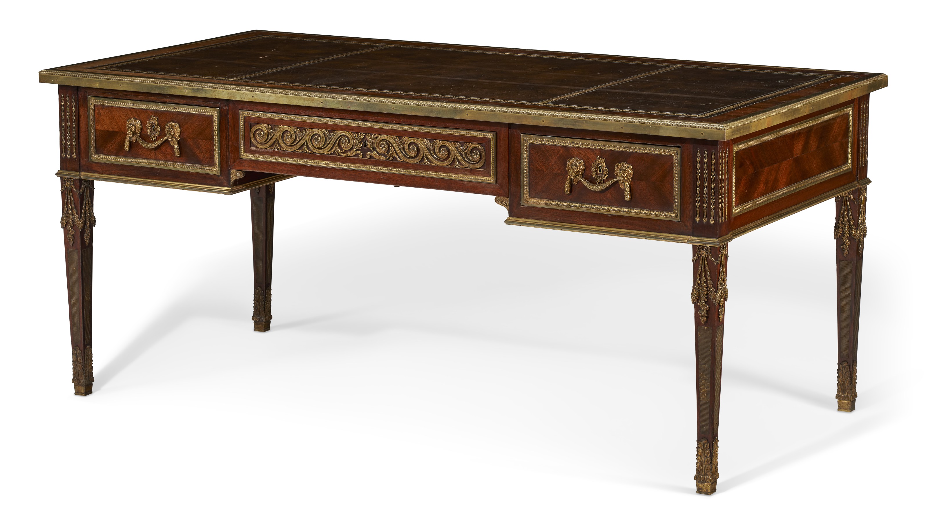 A FRENCH ORMOLU-MOUNTED MAHOGANY BUREAU PLAT, AFTER THE MODEL BY ...