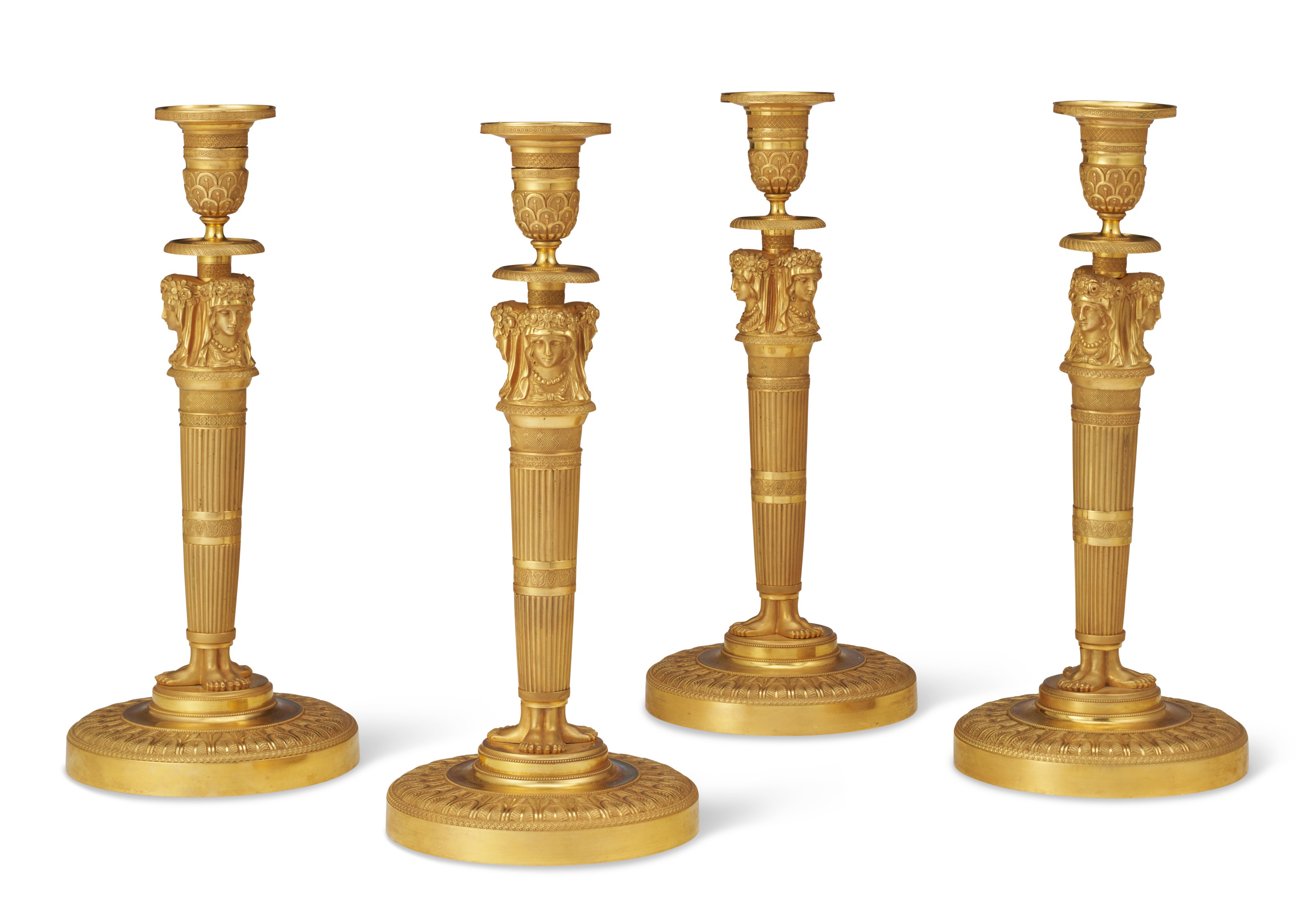 A SET OF FOUR EMPIRE ORMOLU CANDLESTICKS, CIRCA 1810 | Christie’s