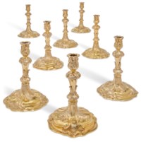 A SET OF EIGHT ROYAL GERMAN SILVER-GILT CANDLESTICKS FROM THE ELECTOR ...