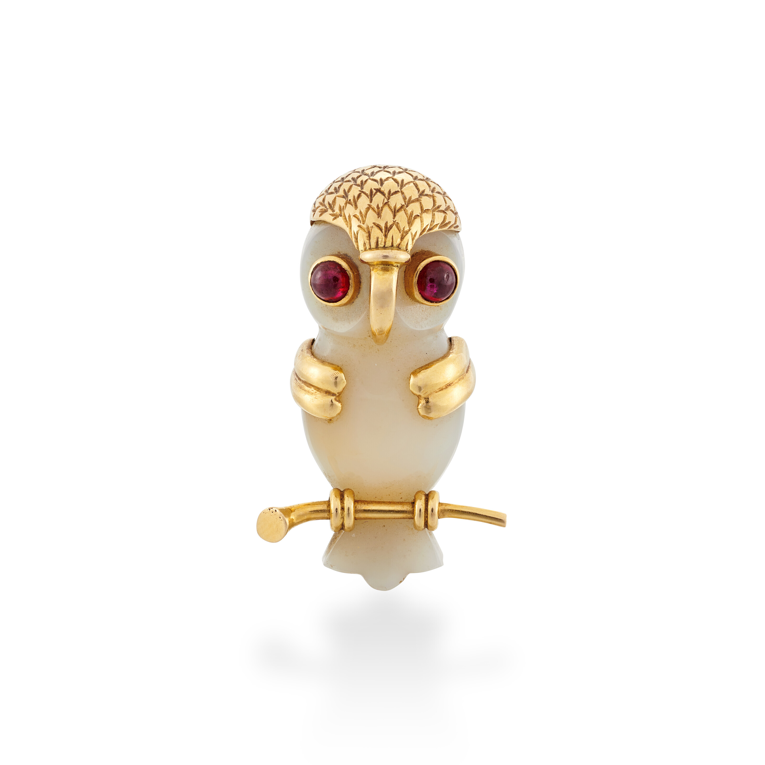 MID 20TH CENTURY CARTIER CHALCEDONY, RUBY AND GOLD OWL BROOCH, | Christie’s