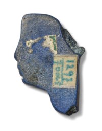 AN EGYPTIAN BLUE GLASS FACE INLAY, PTOLEMAIC PERIOD, CIRCA 332-32 B.C ...