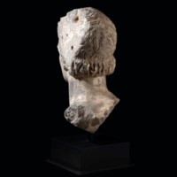 A MONUMENTAL GREEK HEAD OF ALEXANDER THE GREAT