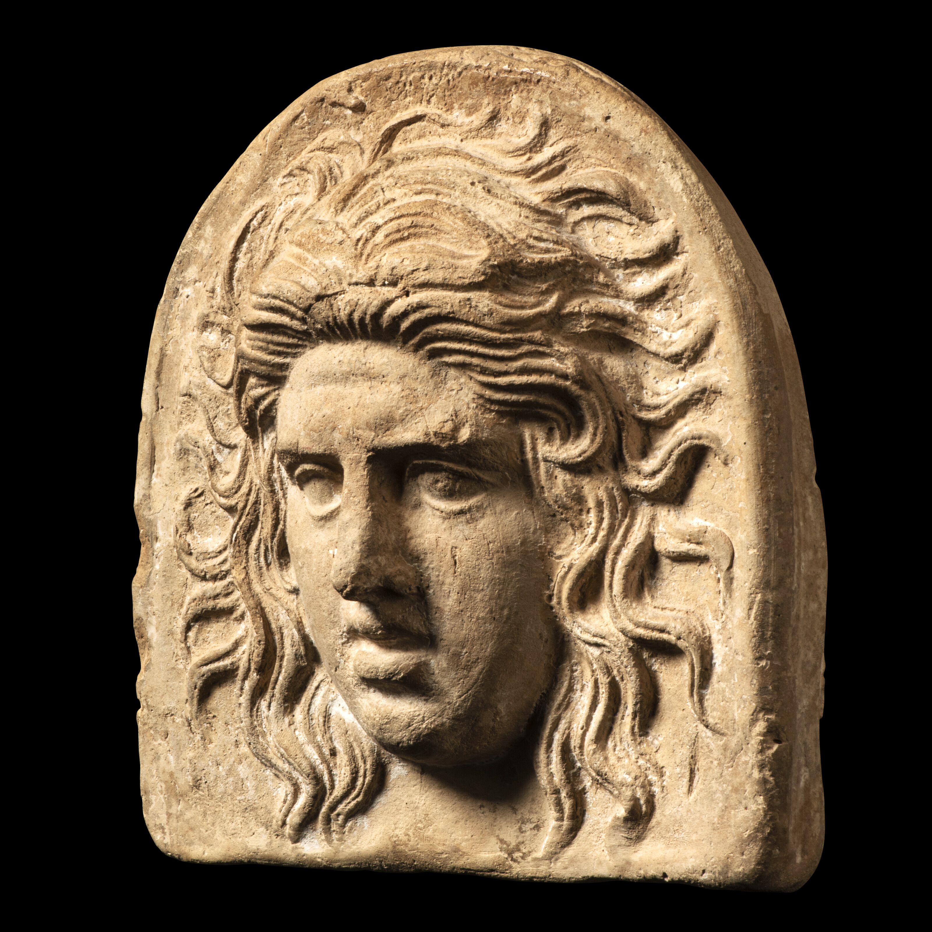 A GREEK TERRACOTTA ANTEFIX, TARANTINE, CIRCA MID-4TH CENTURY B.C ...