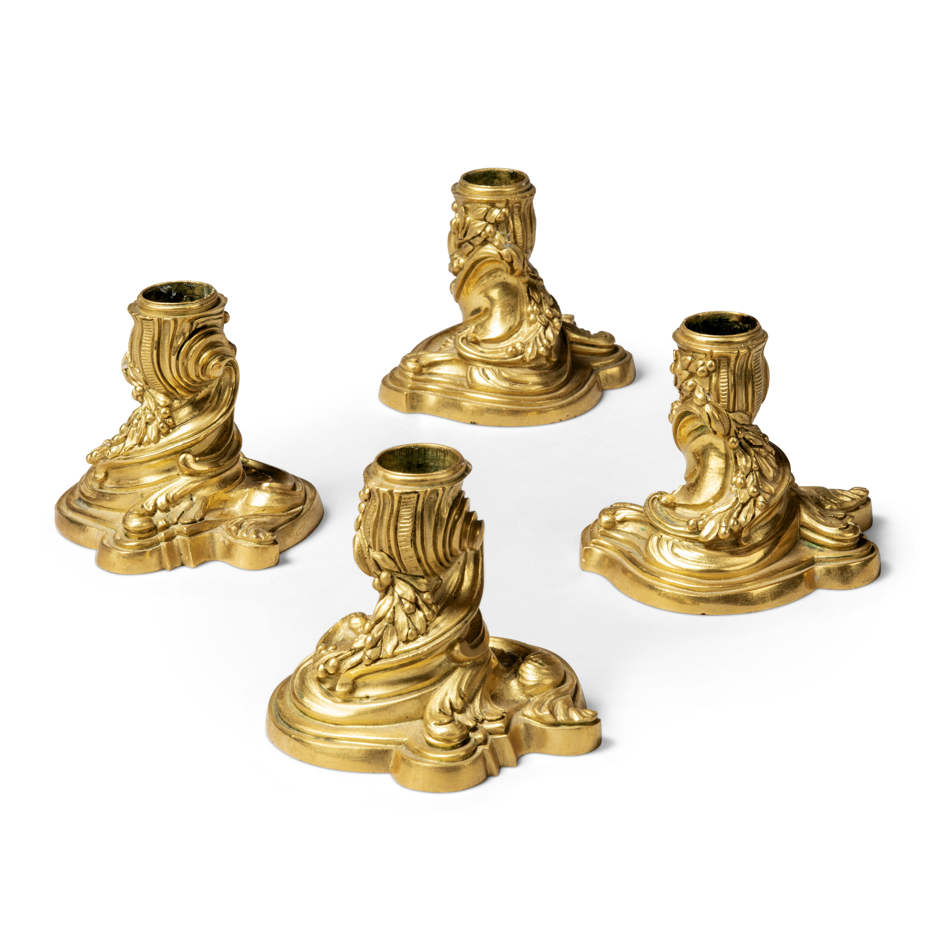 A SET OF FOUR ROCOCO-STYLE ORMOLU SMALL CANDLESTICKS, LATE 19TH/EARLY ...