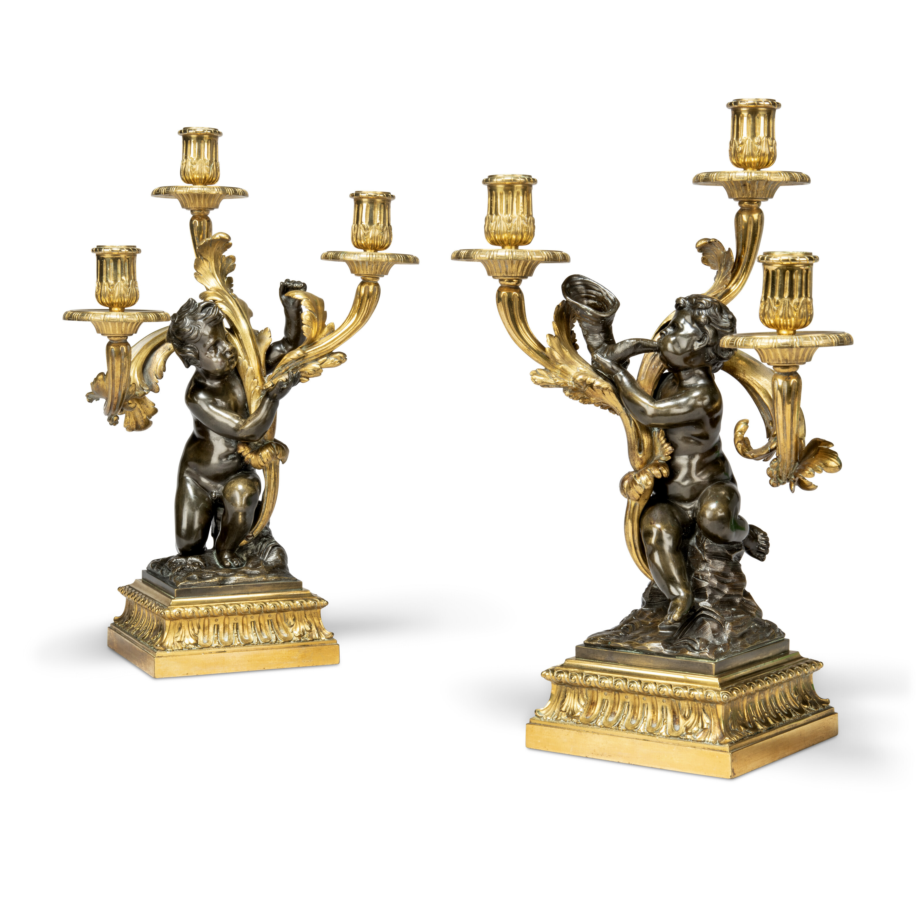 A PAIR OF RESTAURATION PATINATED-BRONZE AND ORMOLU THREE-BRANCH ...