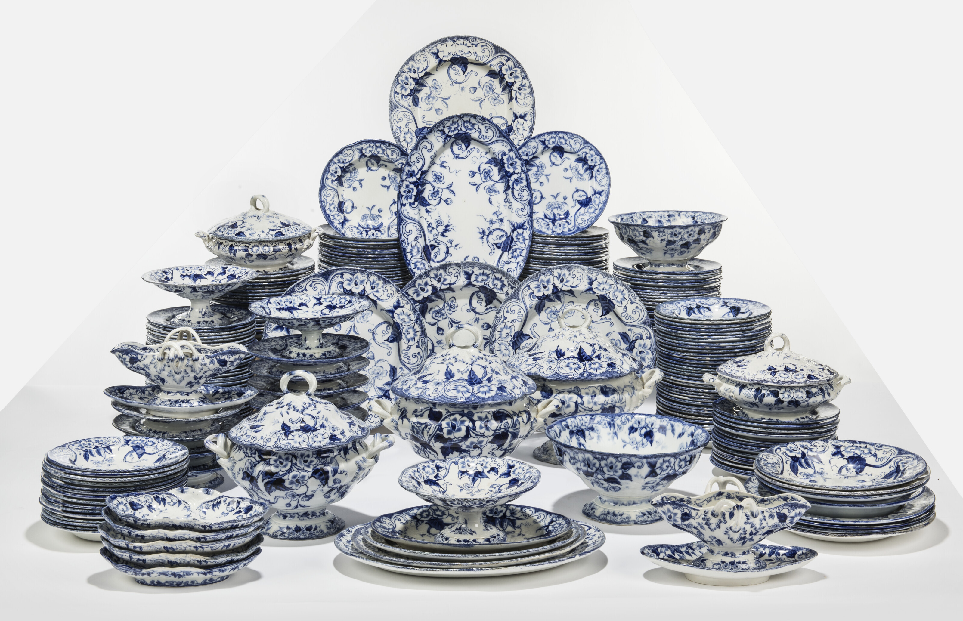 AN EXTENSIVE CRIEL ET MONTEREAU FAIENCE 'FLORA' PATTERN COMPOSITE PART ...