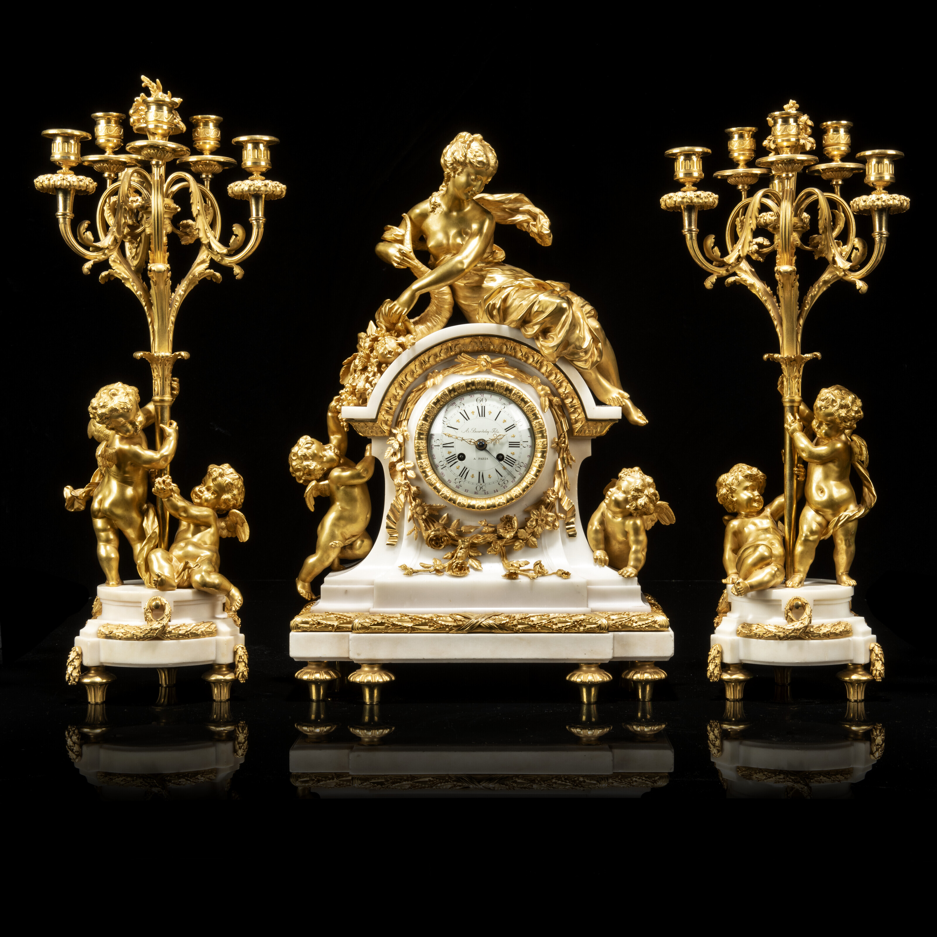 A FINE FRENCH ORMOLU AND WHITE MARBLE THREE-PIECE CLOCK GARNITURE, BY ...
