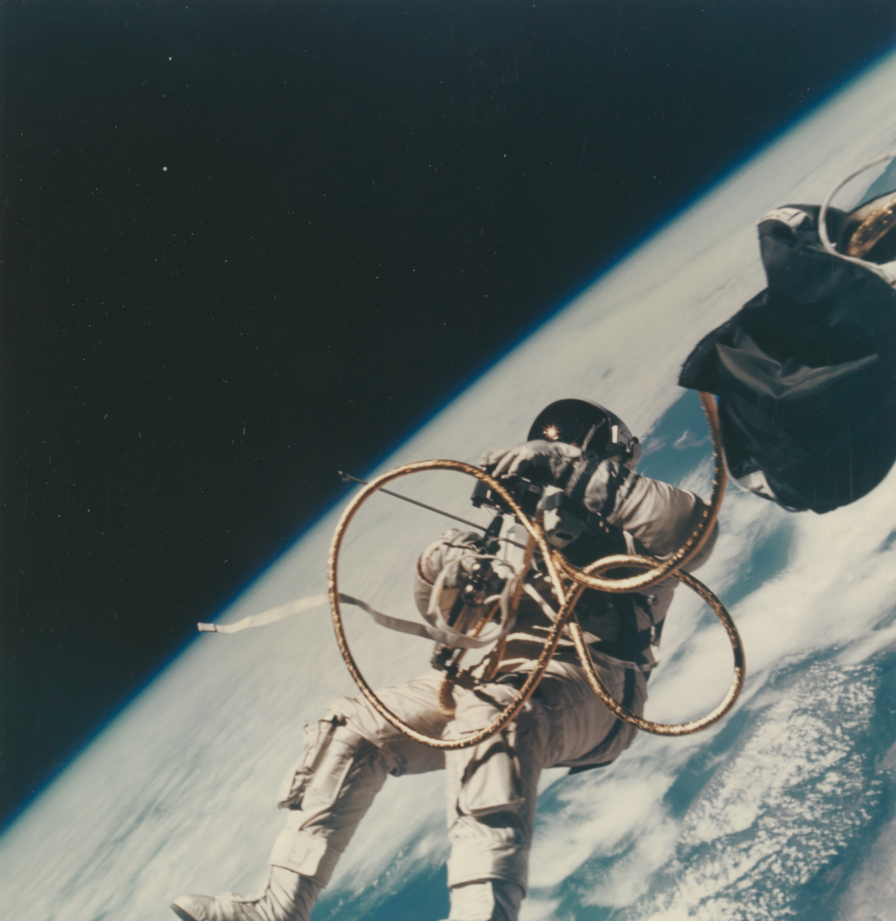 FIRST U.S. SPACEWALK; ED WHITE FLOATING IN SPACE OVER SOUTH CALIFORNIA ...