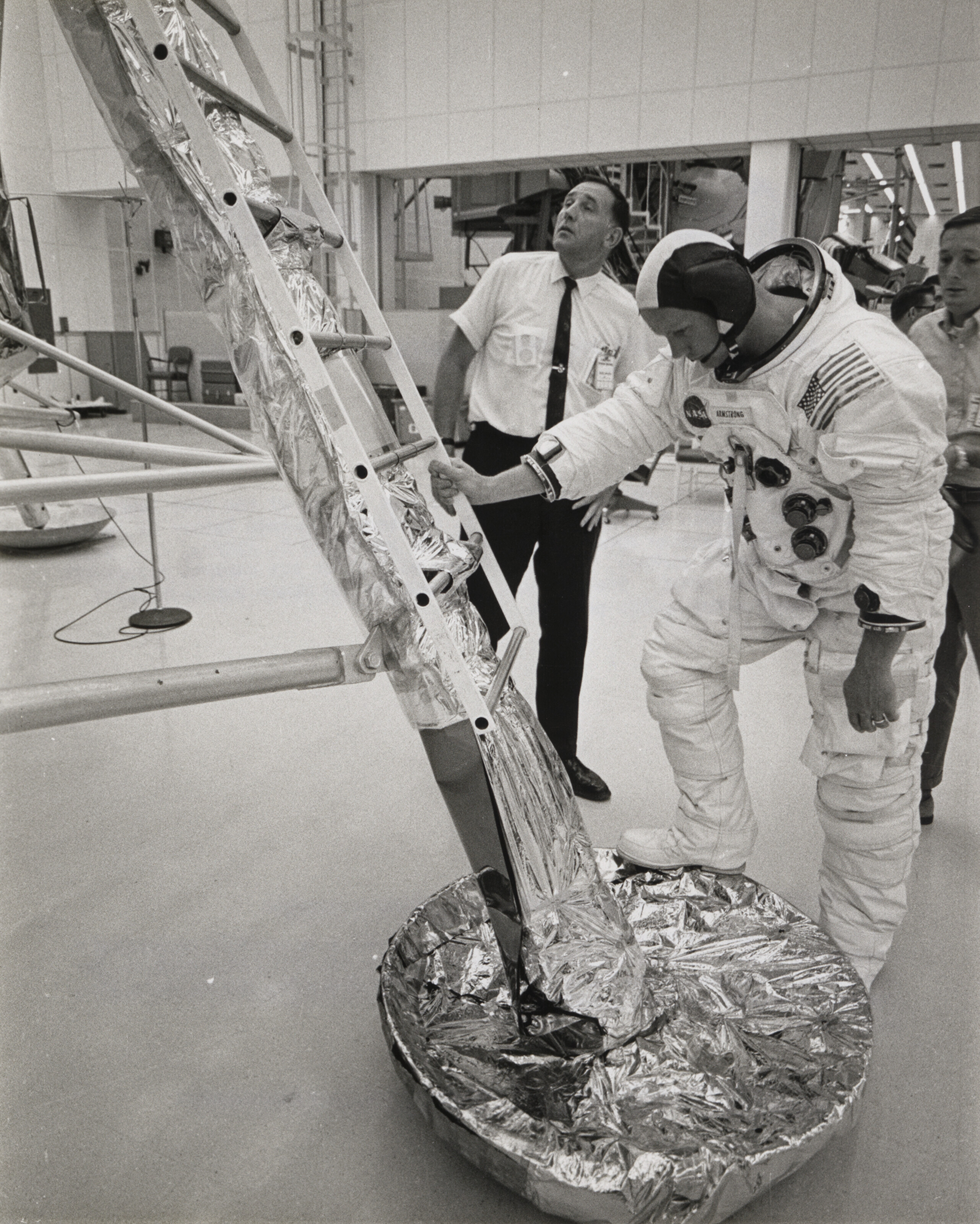 NEIL ARMSTRONG DESCENDS LADDER OF LUNAR MODULE TRAINING SPACECRAFT ...