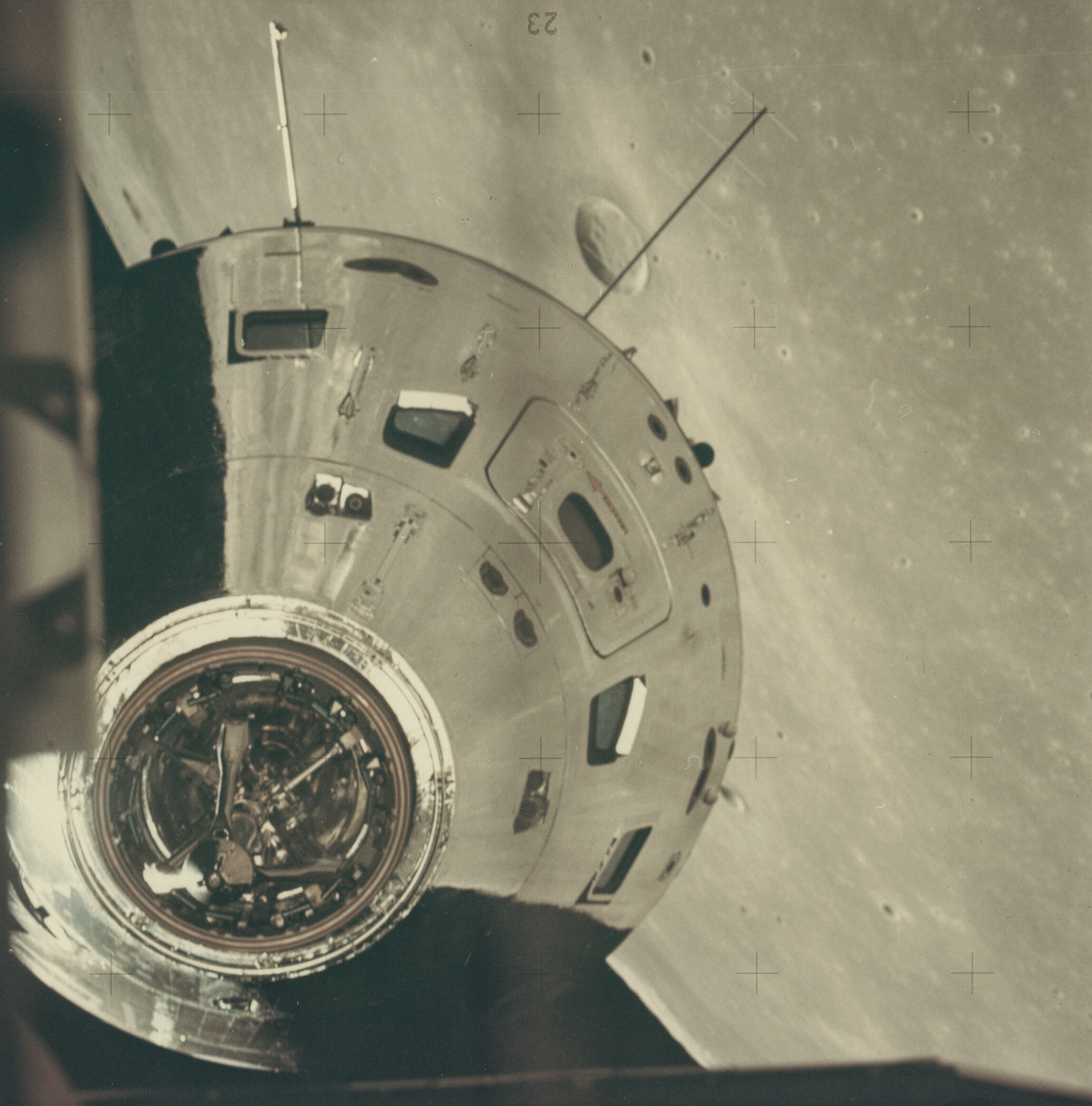 THE COMMAND MODULE AMERICA WITH ALL FIVE WINDOWS FACING THE MOON ...