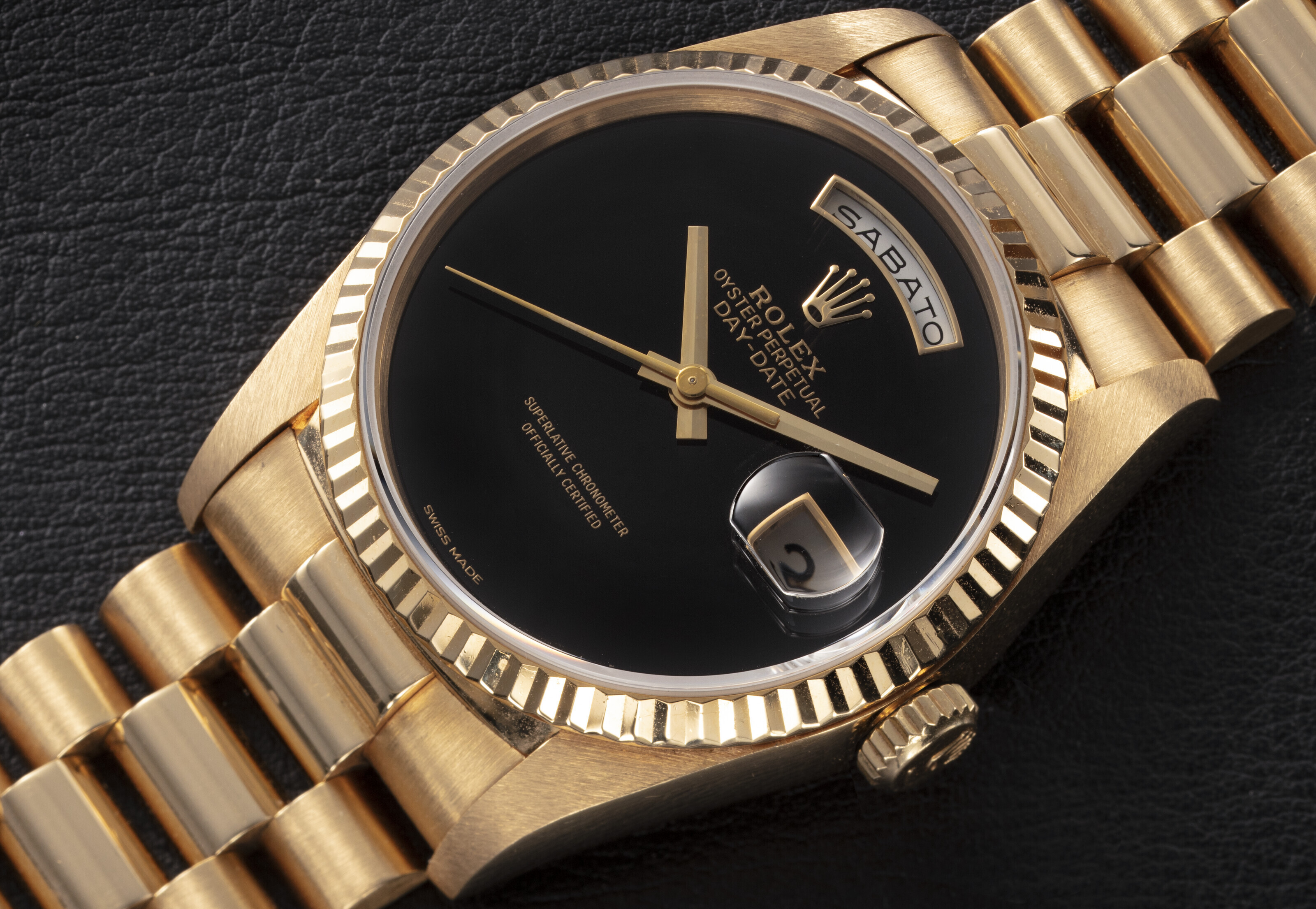 ROLEX, DAY-DATE REF. 18238, A GOLD AUTOMATIC WRISTWATCH WITH ONYX DATE ...