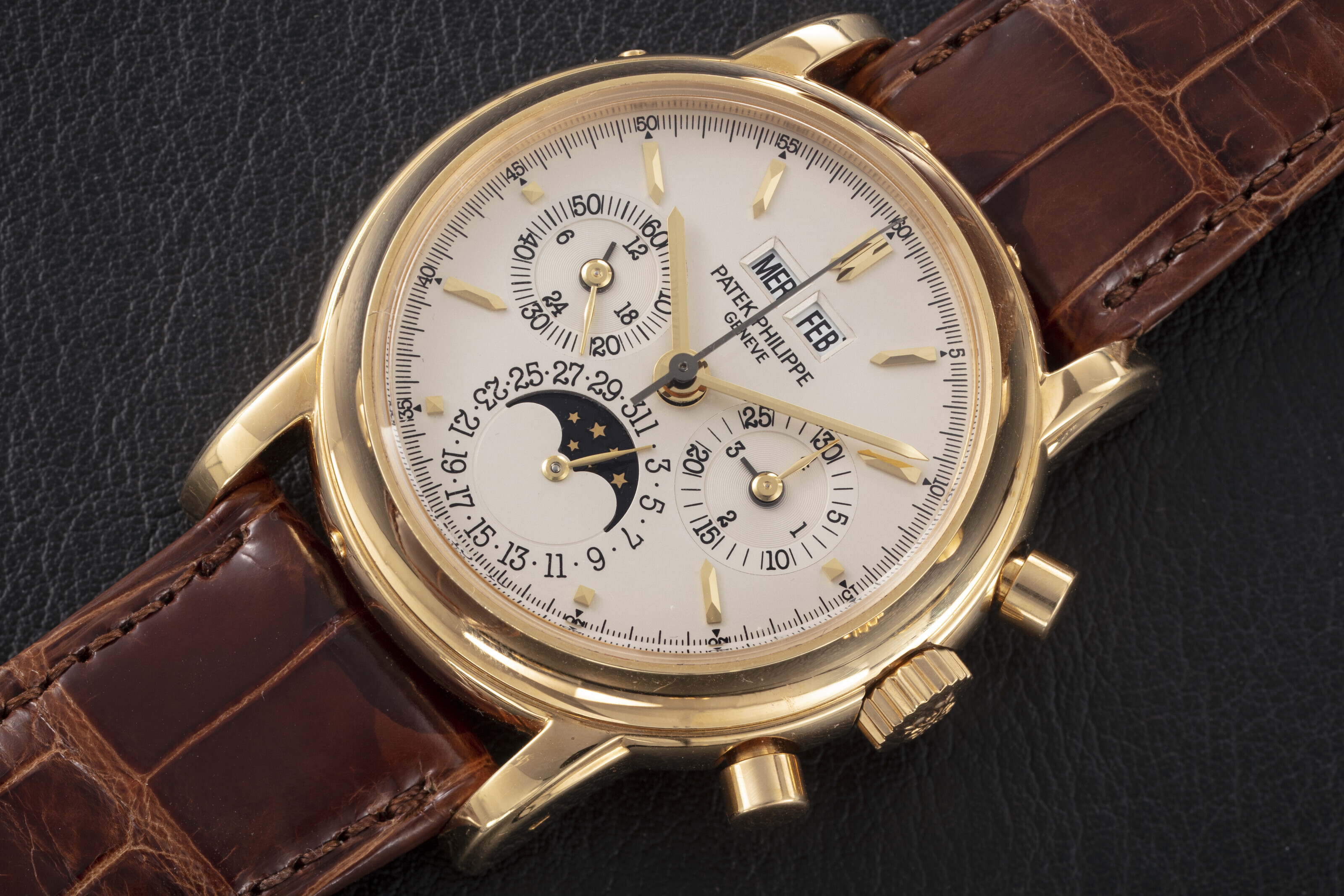 PATEK PHILIPPE, REF. 3970E 'FOURTH SERIES', A GOLD PERPETUAL CALENDAR ...