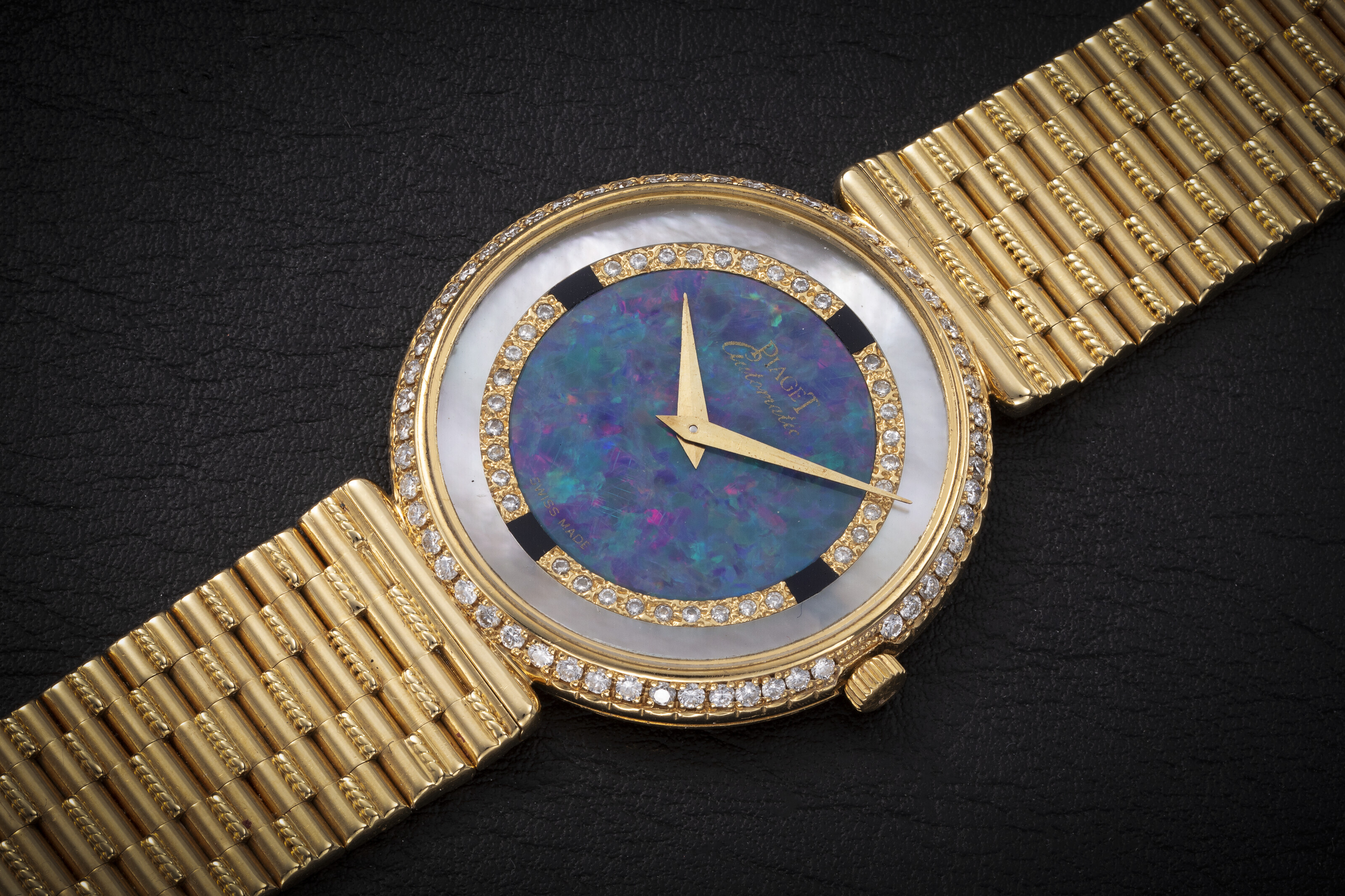 PIAGET, A GOLD AND DIAMOND-SET DIAL WITH MOTHER-OF-PEARL AND STONE DIAL ...