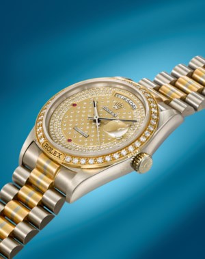 ROLEX. A VERY RARE AND ATTRACTIVE THREE COLOUR GOLD, DIAMOND AND RUBY ...
