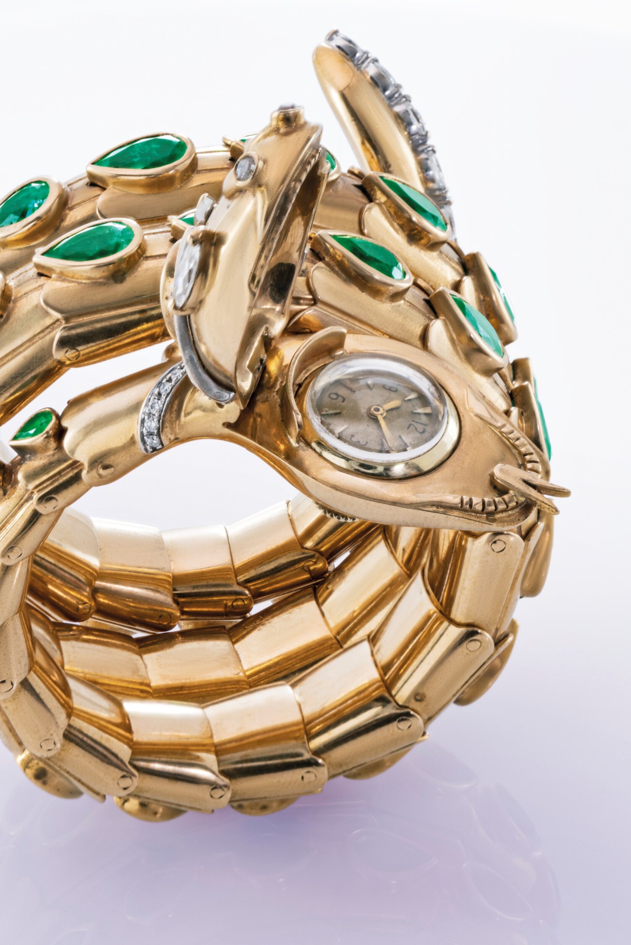 BULGARI EMERALD, DIAMOND AND GOLD ‘SERPENTI’ BRACELET-WATCH | Christie's