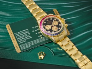 ROLEX. A RARE AND IMPRESSIVE 18K GOLD, DIAMOND AND MULTI-COLOURED ...