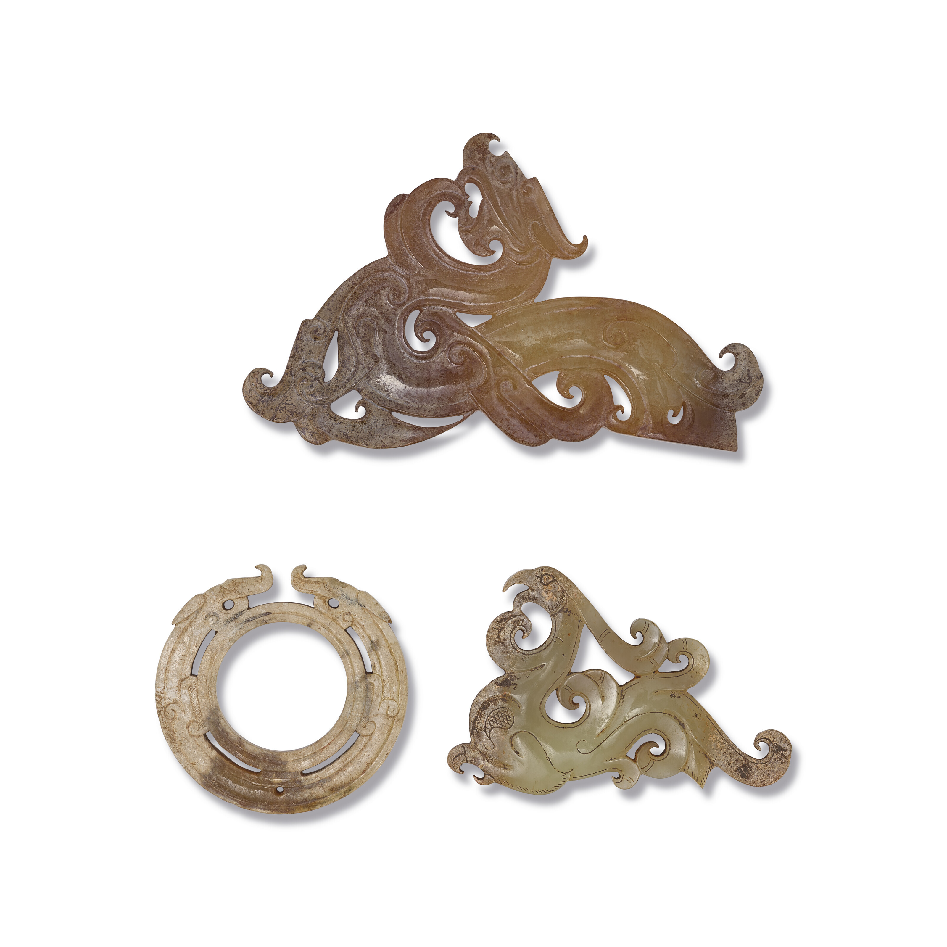A GROUP OF THREE ARCHAISTIC JADE CARVINGS, | Christie’s