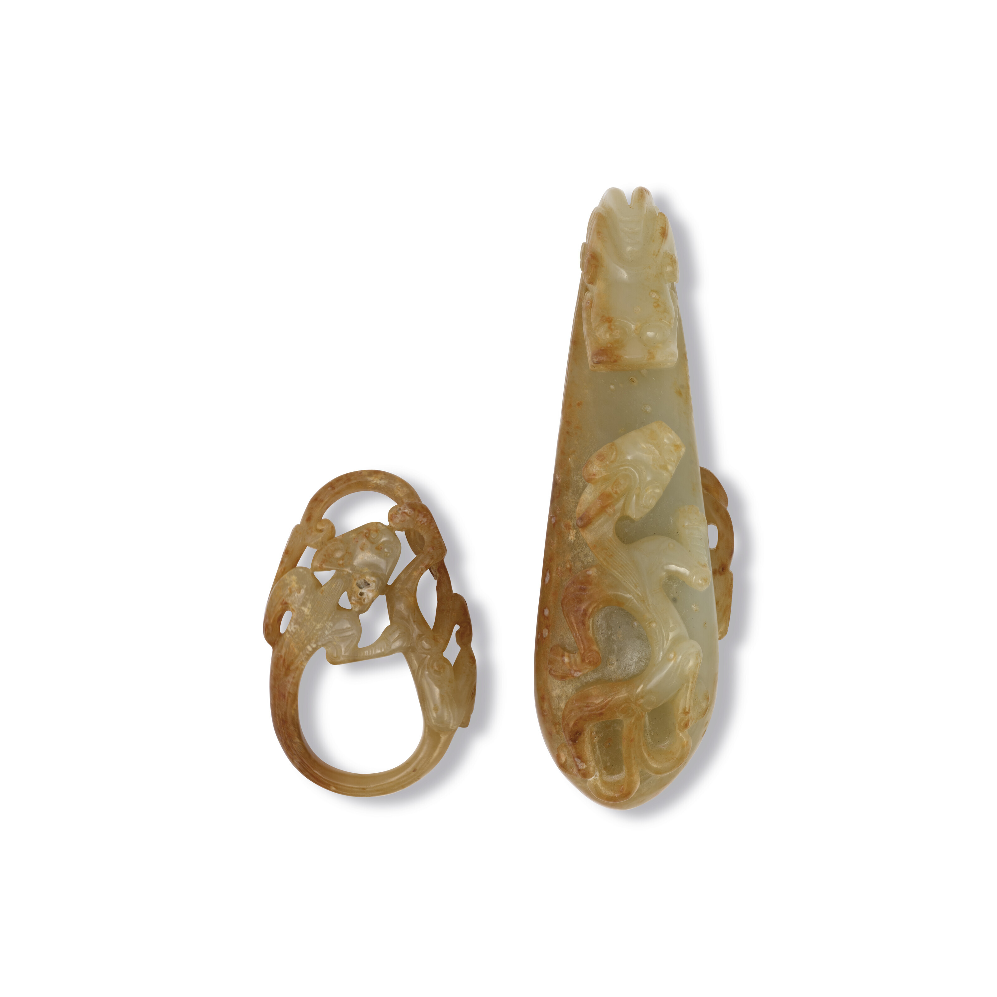 A RARE WHITE AND RUSSET JADE ‘DRAGON’ BELT HOOK AND BUCKLE, YUAN- MING ...