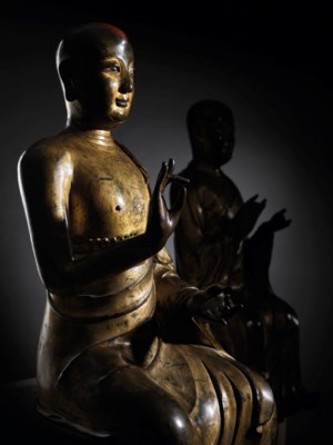 AN EXCEEDINGLY RARE PAIR OF GILT-BRONZE SEATED LUOHAN FIGURES, YUAN ...