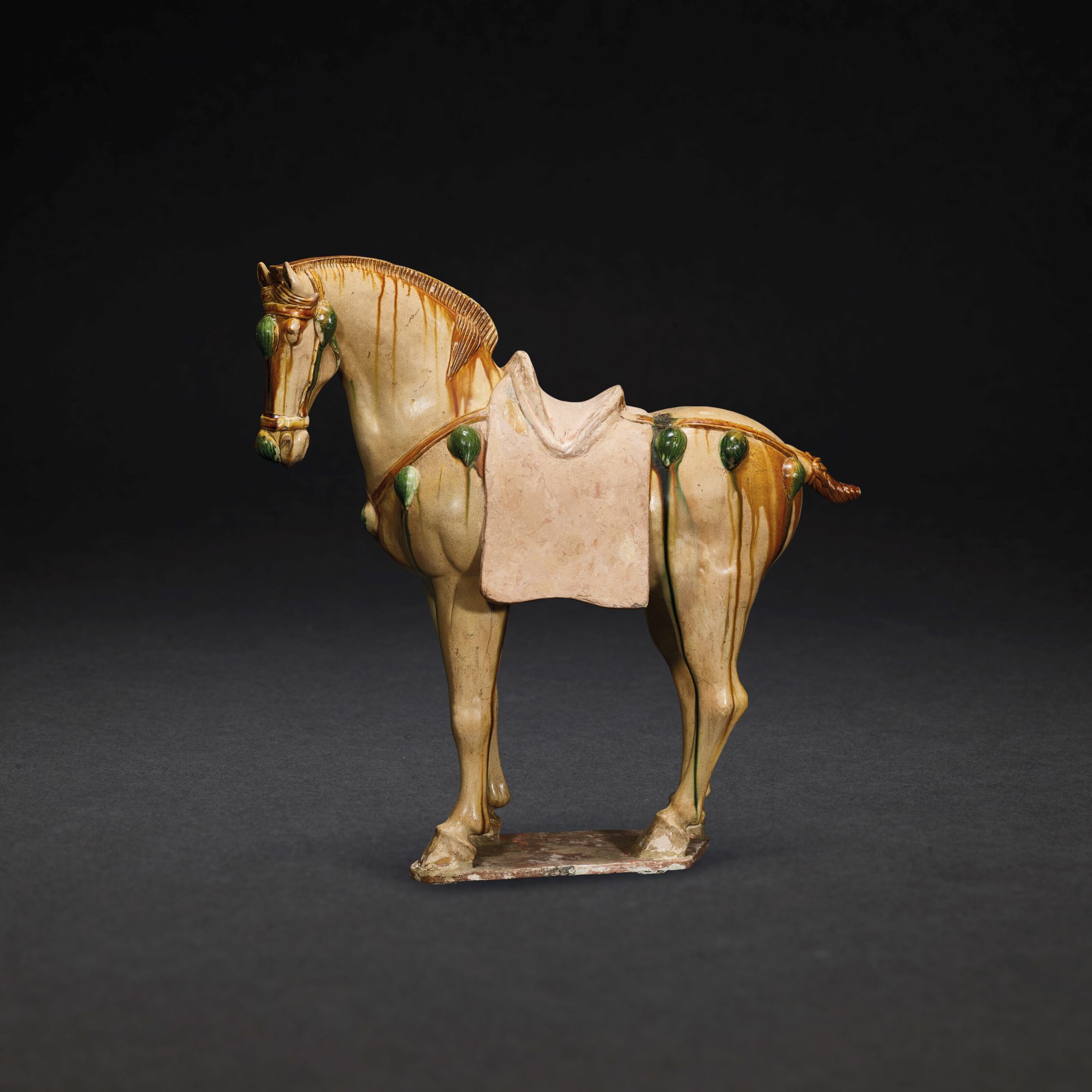 A LARGE SANCAI-GLAZED POTTERY FIGURE OF A HORSE, TANG DYNASTY (AD 618 ...