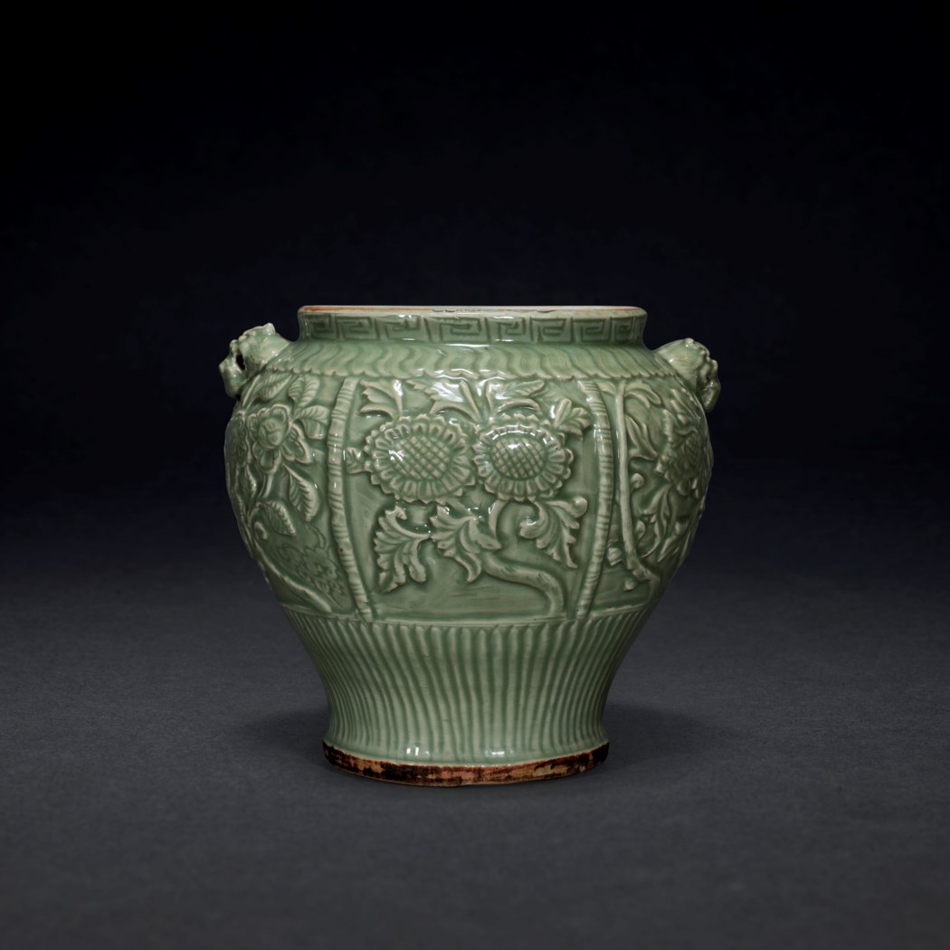 A RARE FINELY CARVED LONGQUAN CELADON ‘FLORAL’ JAR, EARLY MING DYNASTY ...
